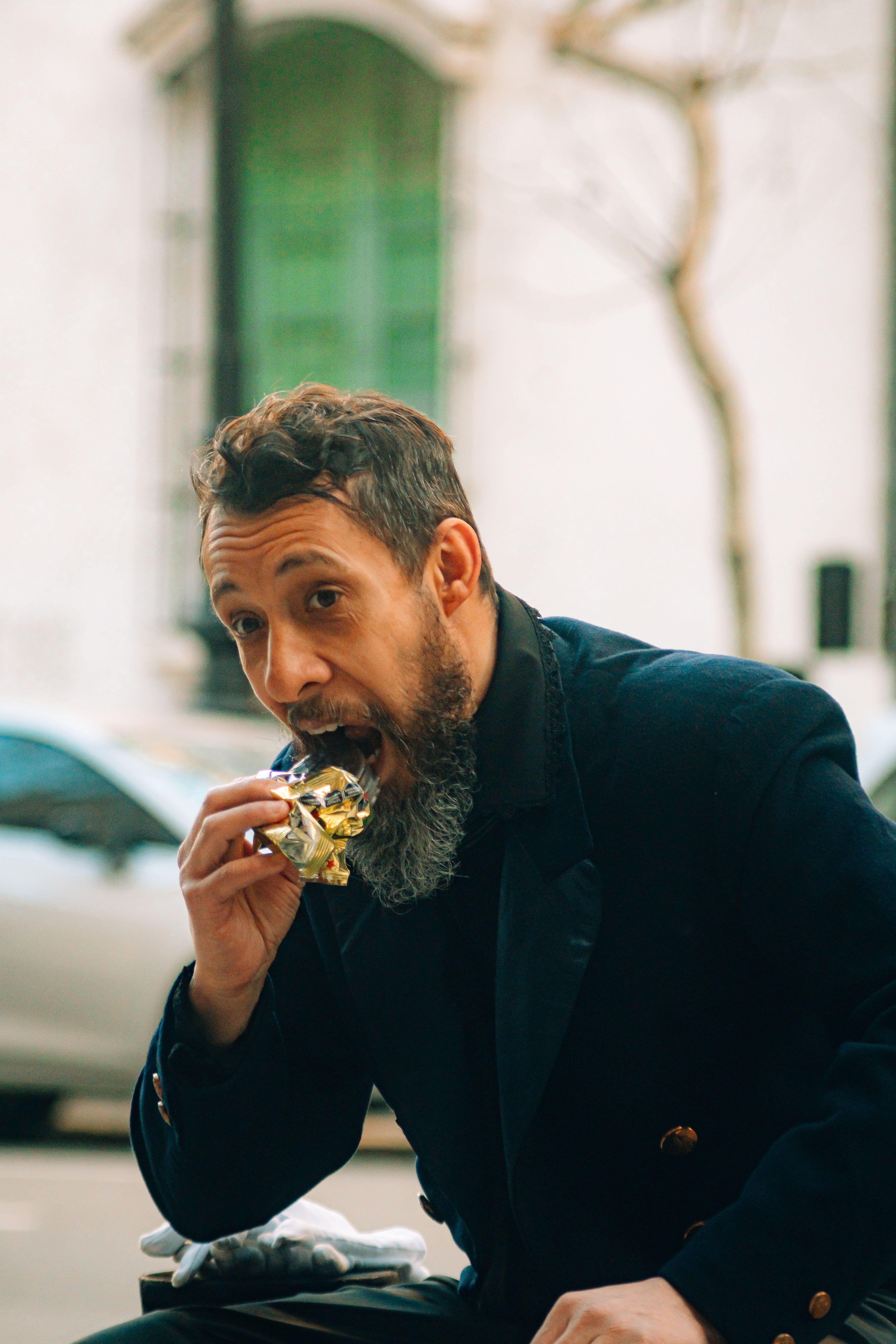 Man Eating Snack in Buenos Aires Street Scene · Free Stock Photo