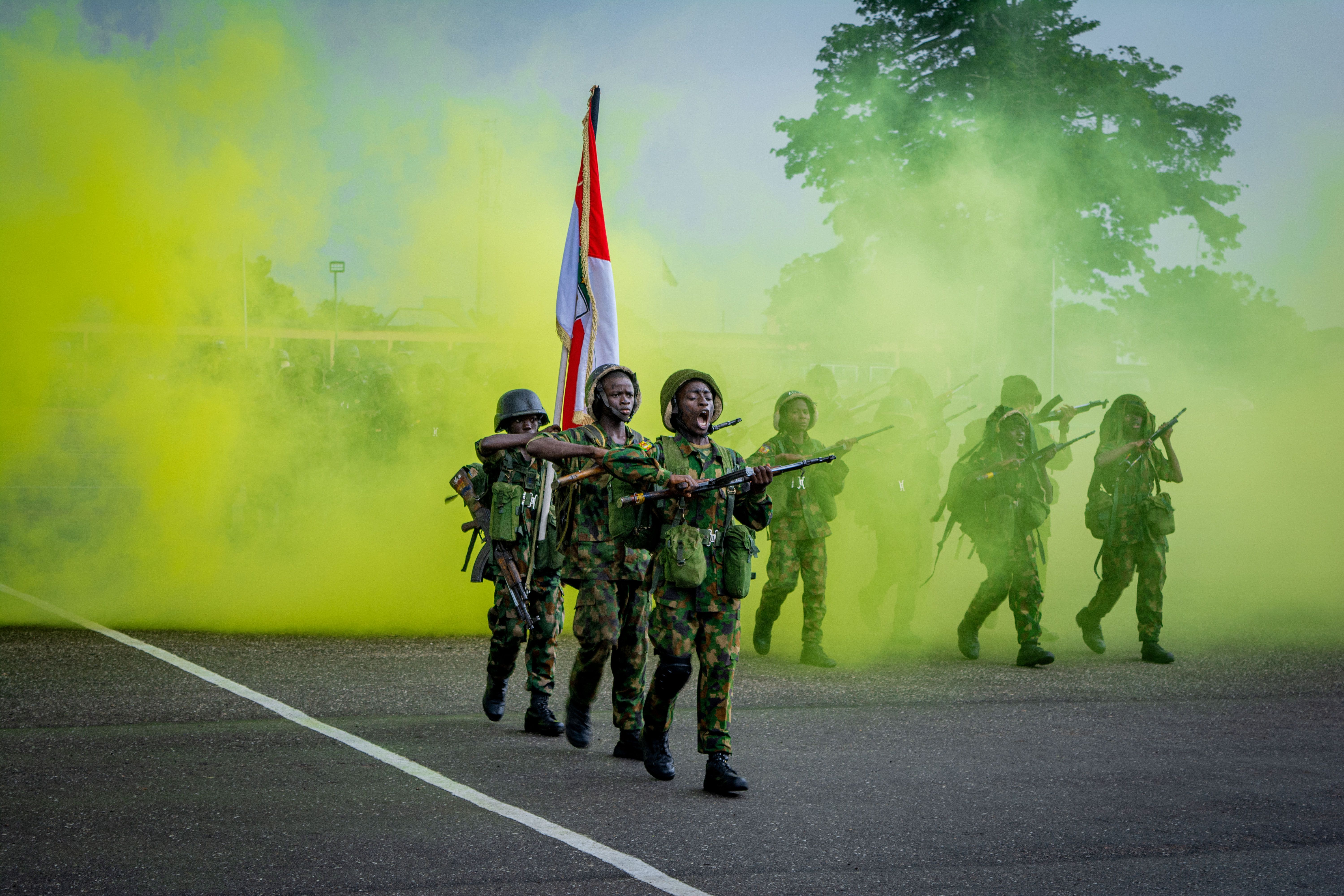 Military Troops Marching with Colorful Smoke Display · Free Stock Photo