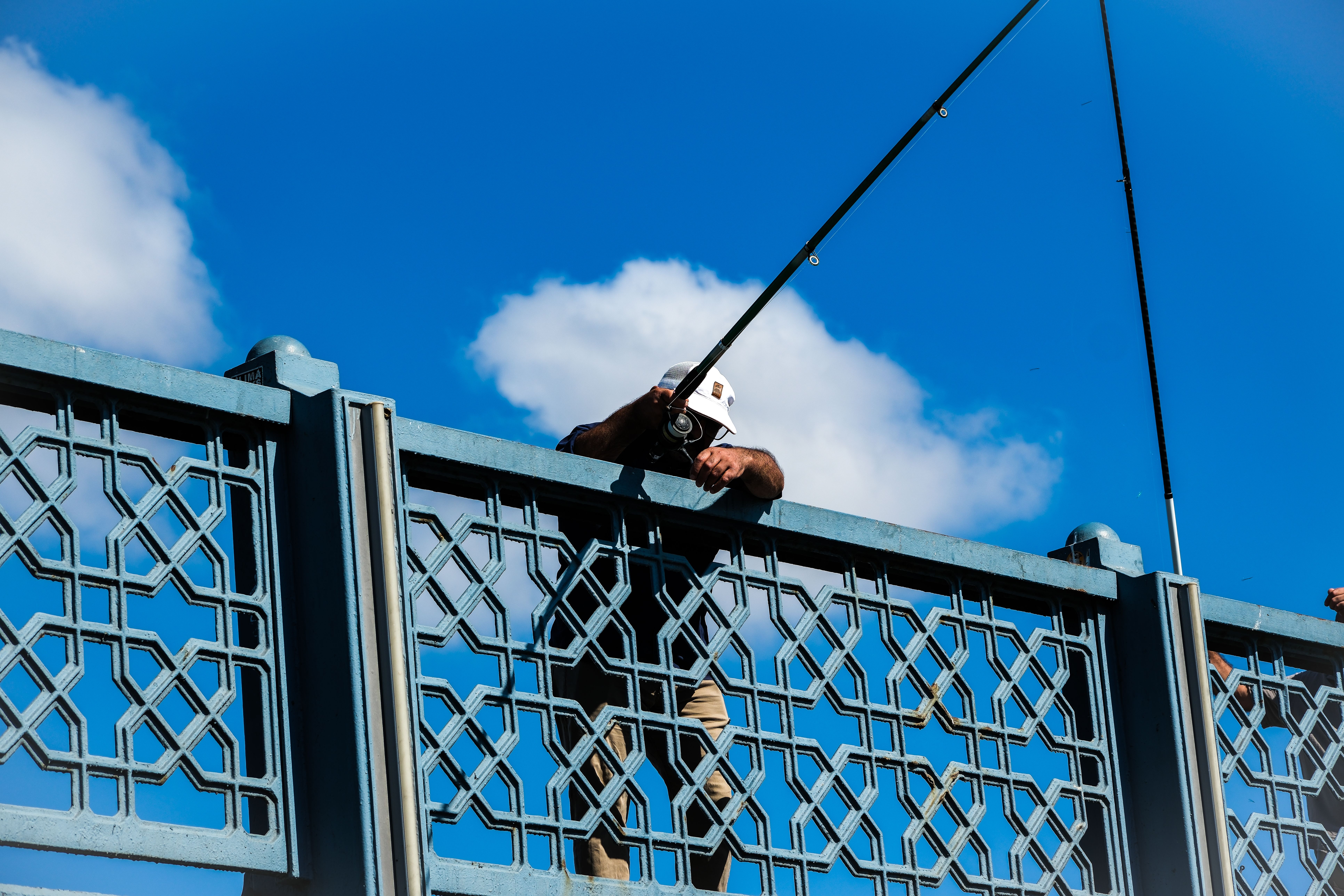 Man Fishing from Galata Bridge in İstanbul · Free Stock Photo
