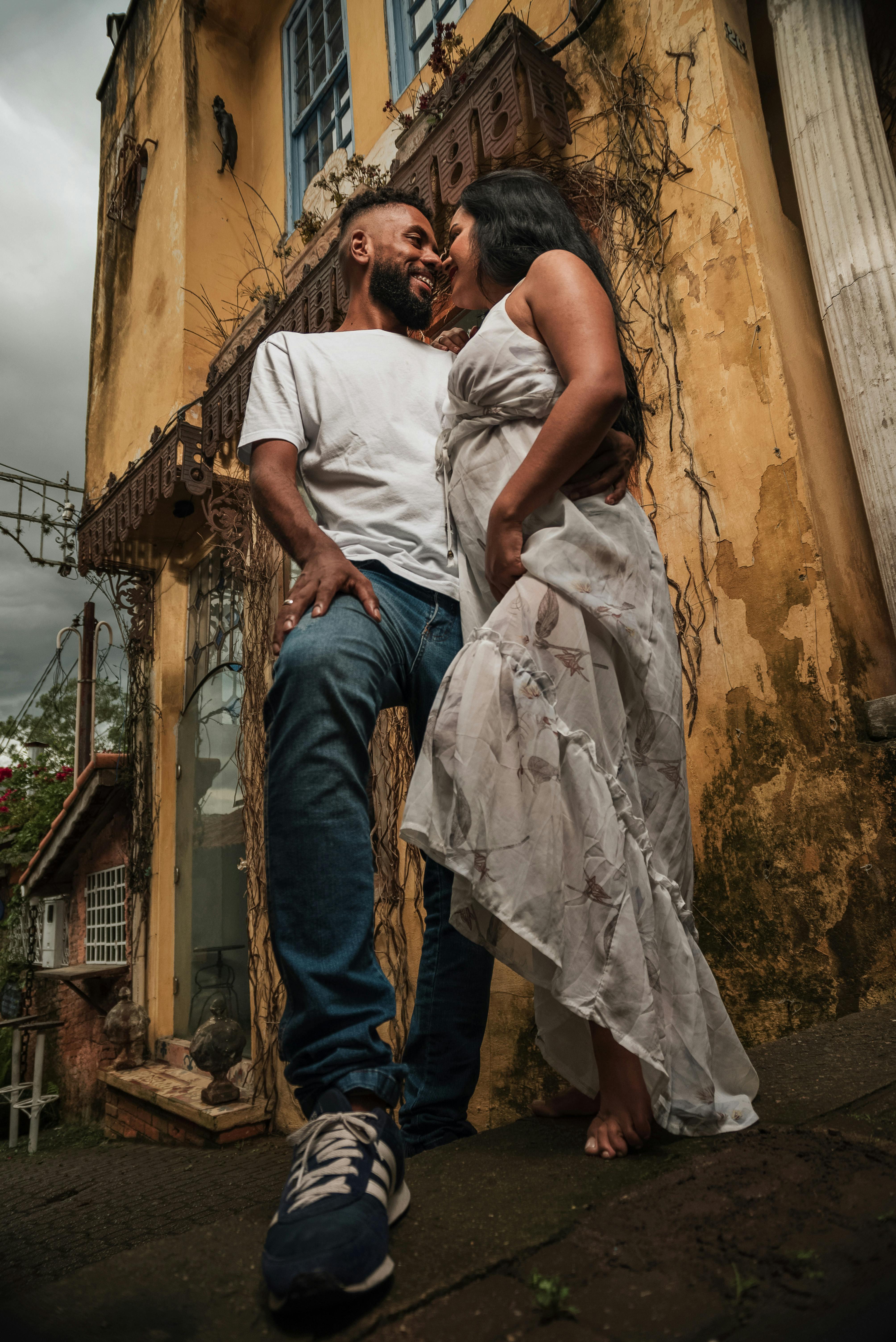 Couple Near Wall · Free Stock Photo