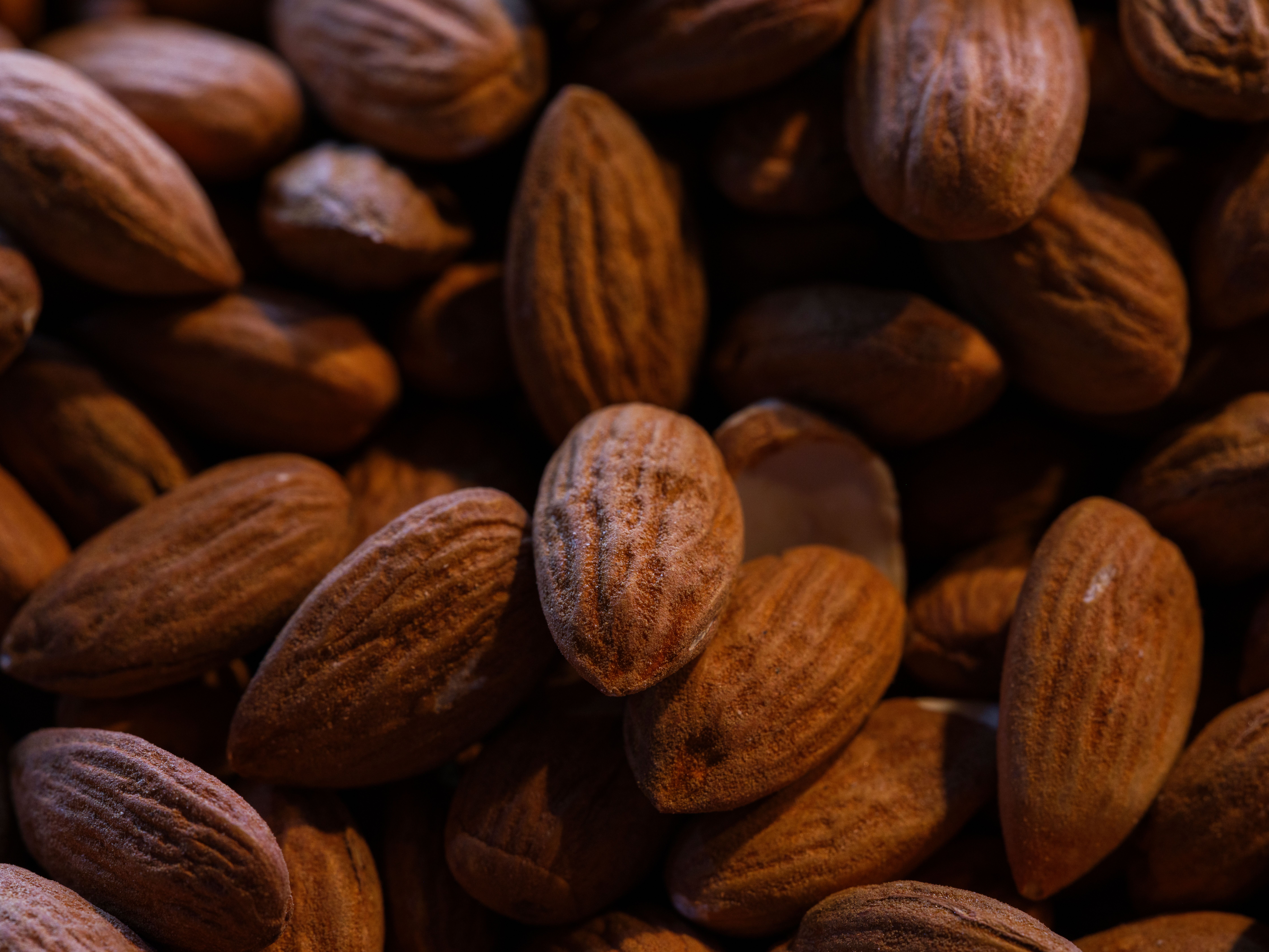 Close-up of Fresh Raw Almonds on Display · Free Stock Photo