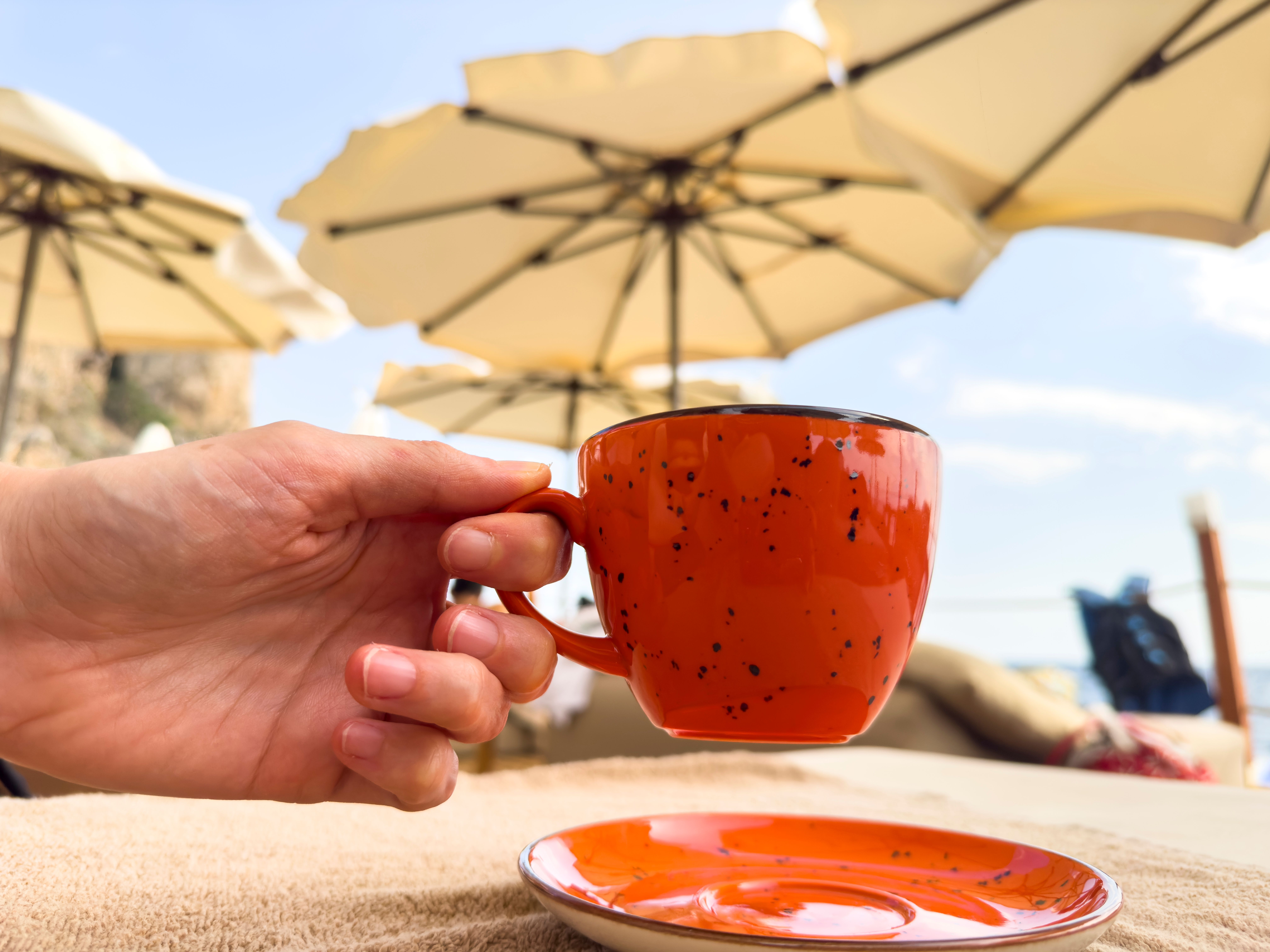 Coffee Relaxation at Beachside with Umbrellas · Free Stock Photo