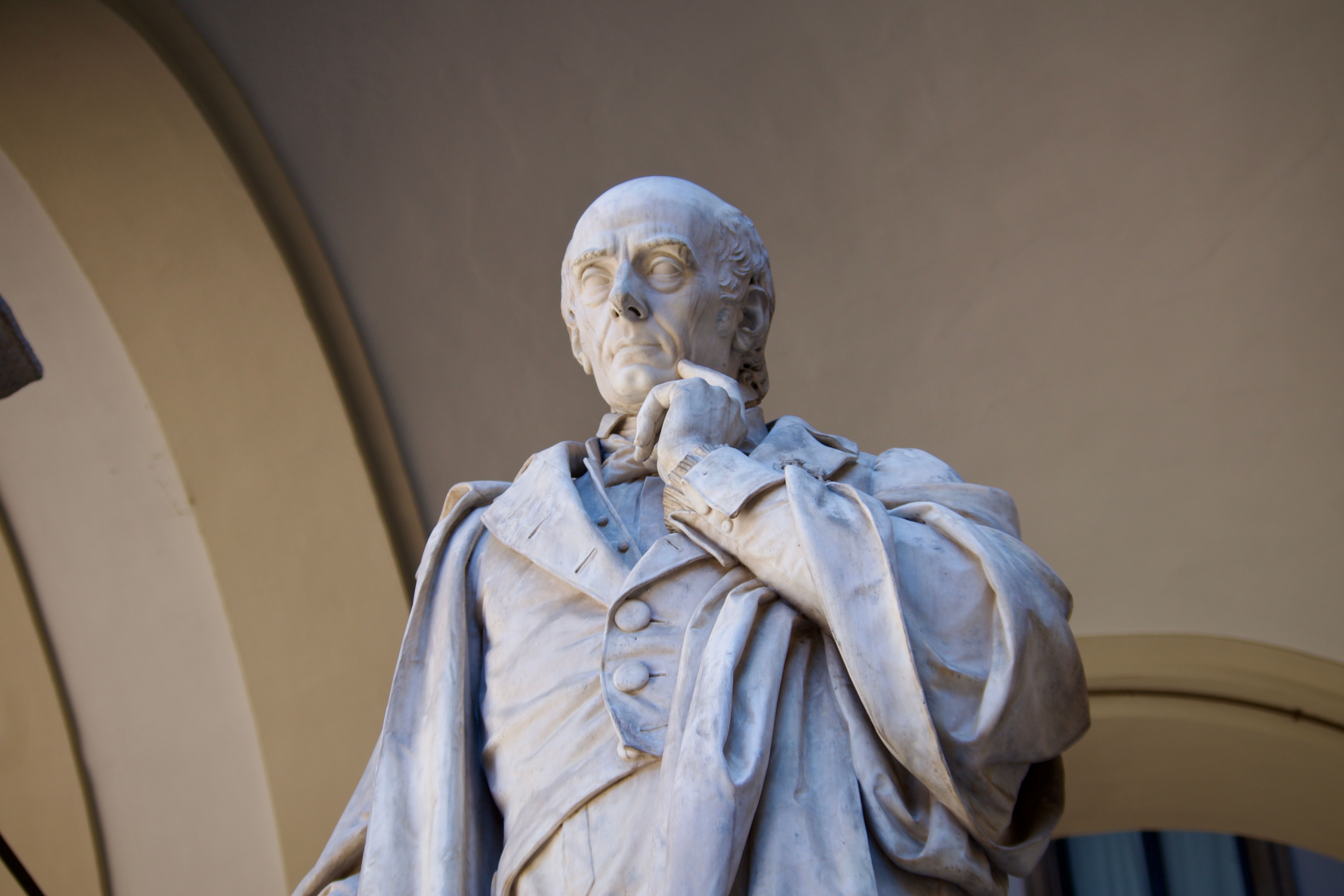 Elegant Marble Statue in Thoughtful Pose · Free Stock Photo