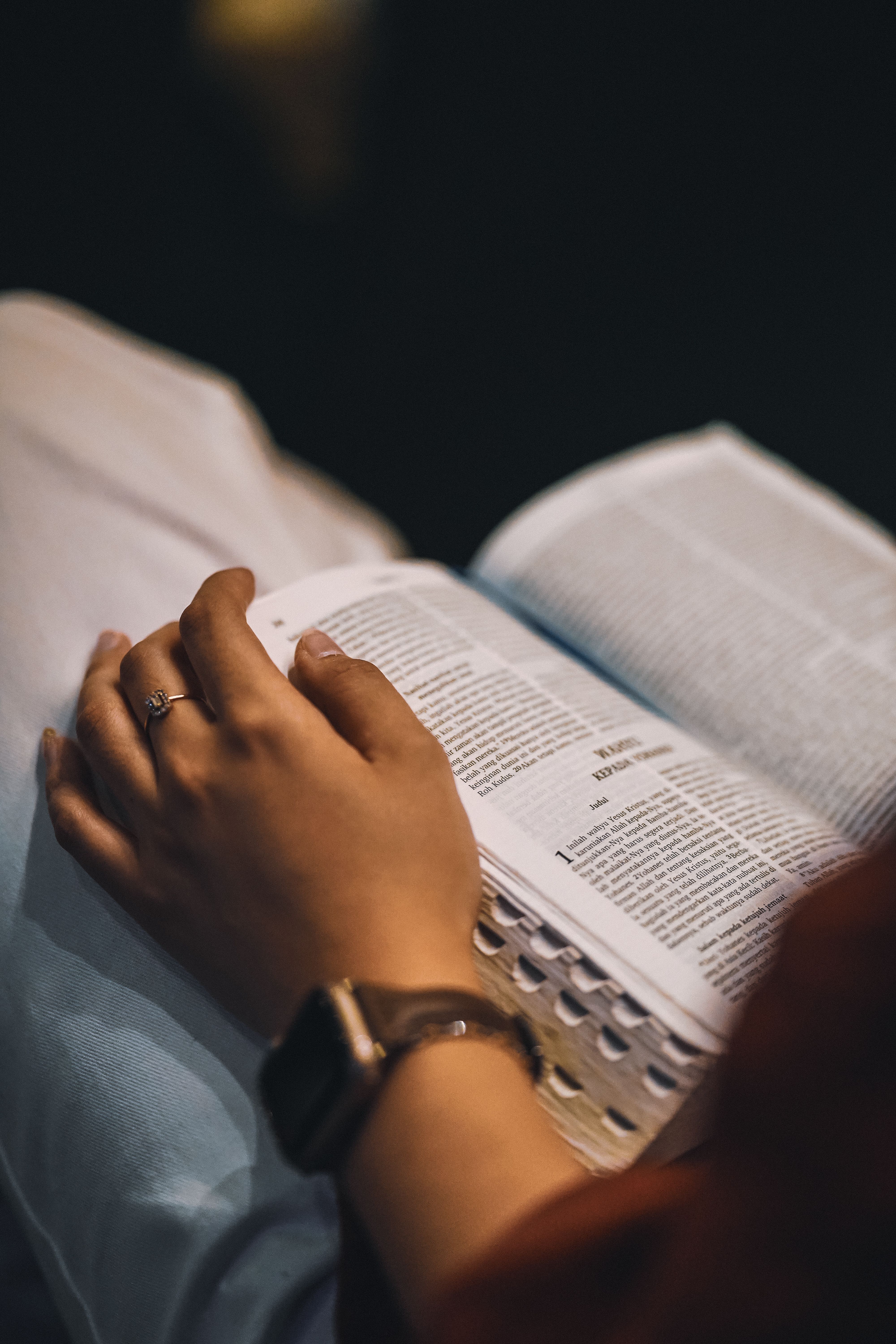 Close-Up Shot of a Person Reading a Bible · Free Stock Photo