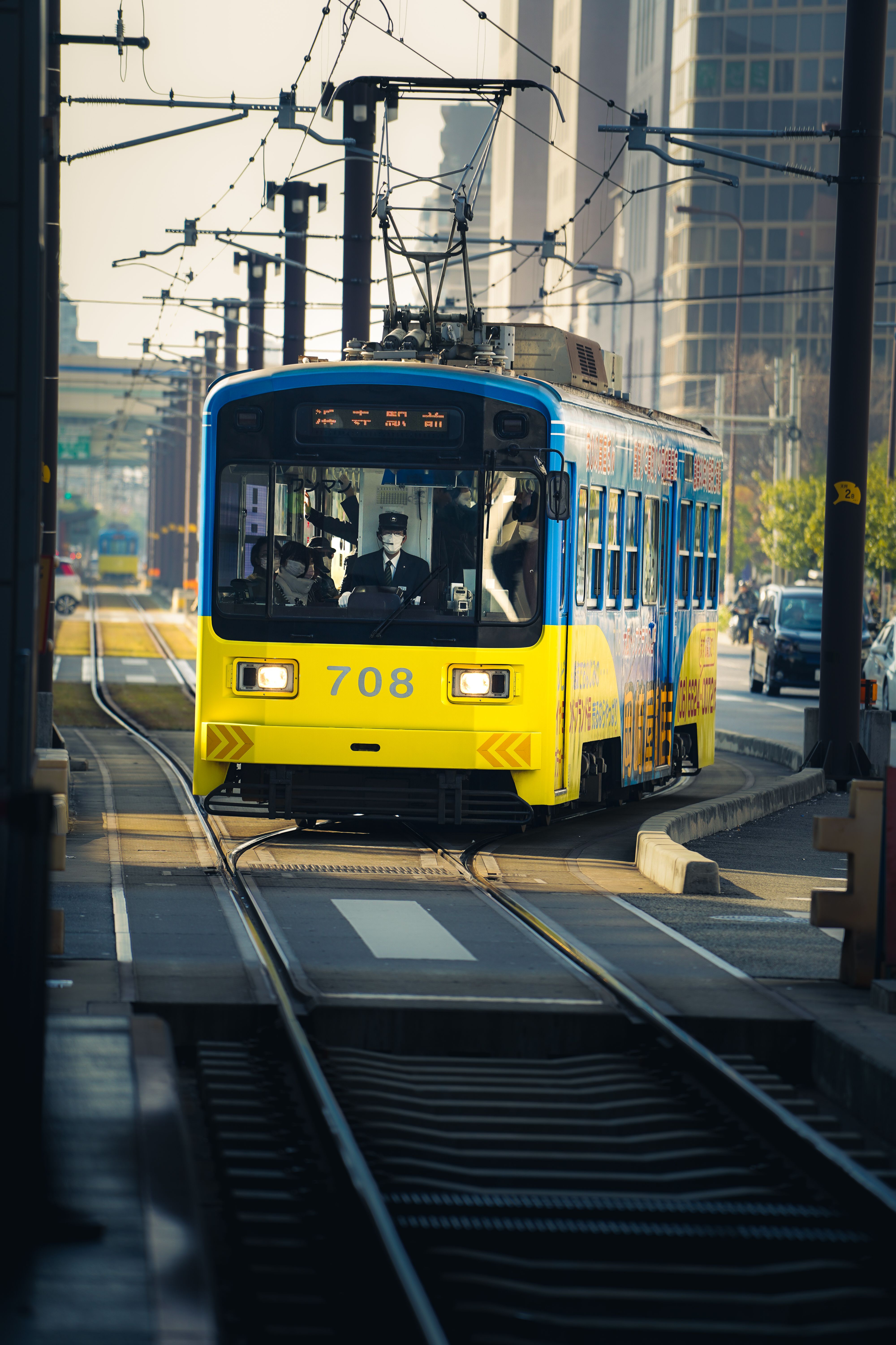 Selective Color Photography of Yellow Train Near Concrete Buildings ...