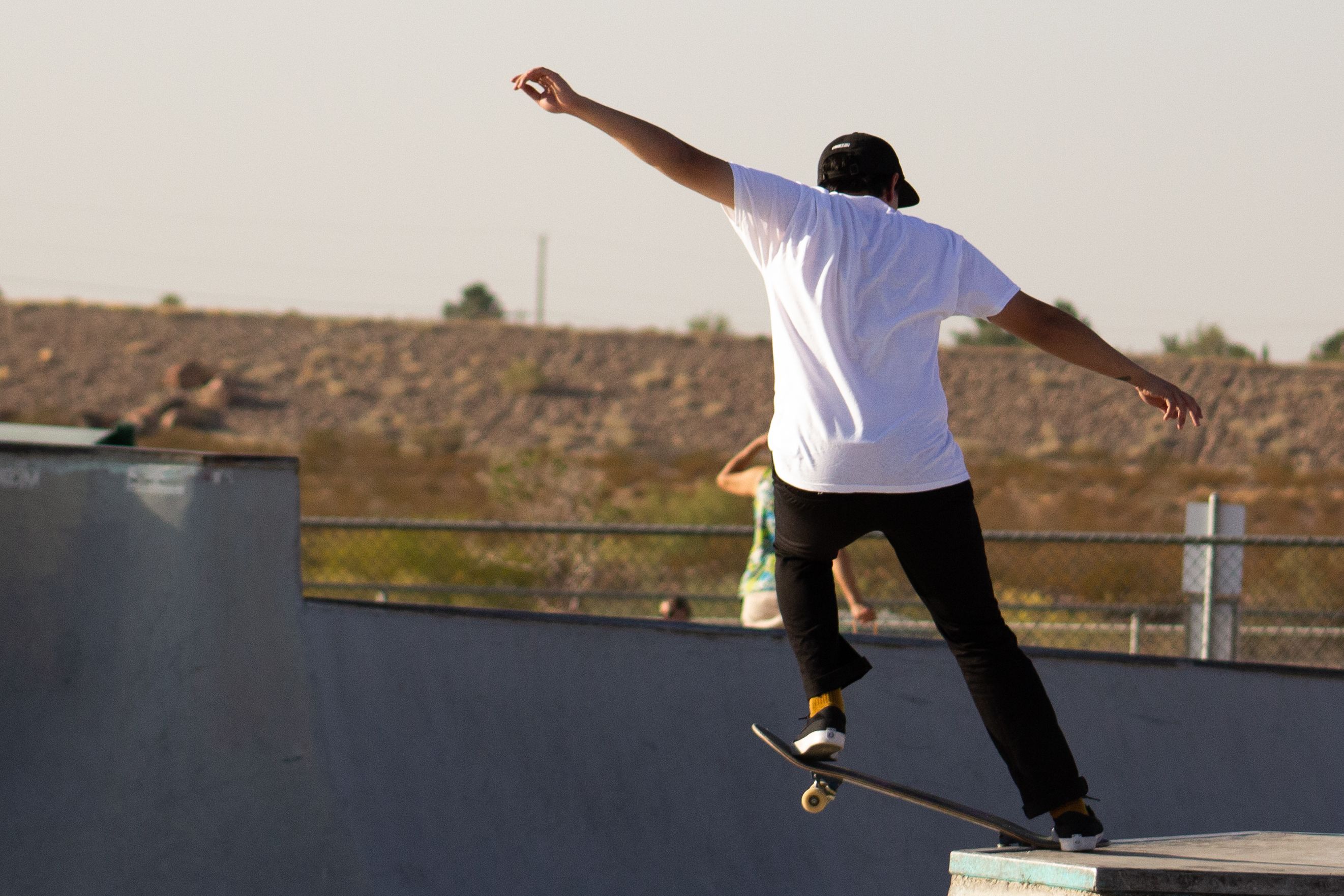 Skateboarder Prepares for Urban Trick in Cityscape · Free Stock Photo
