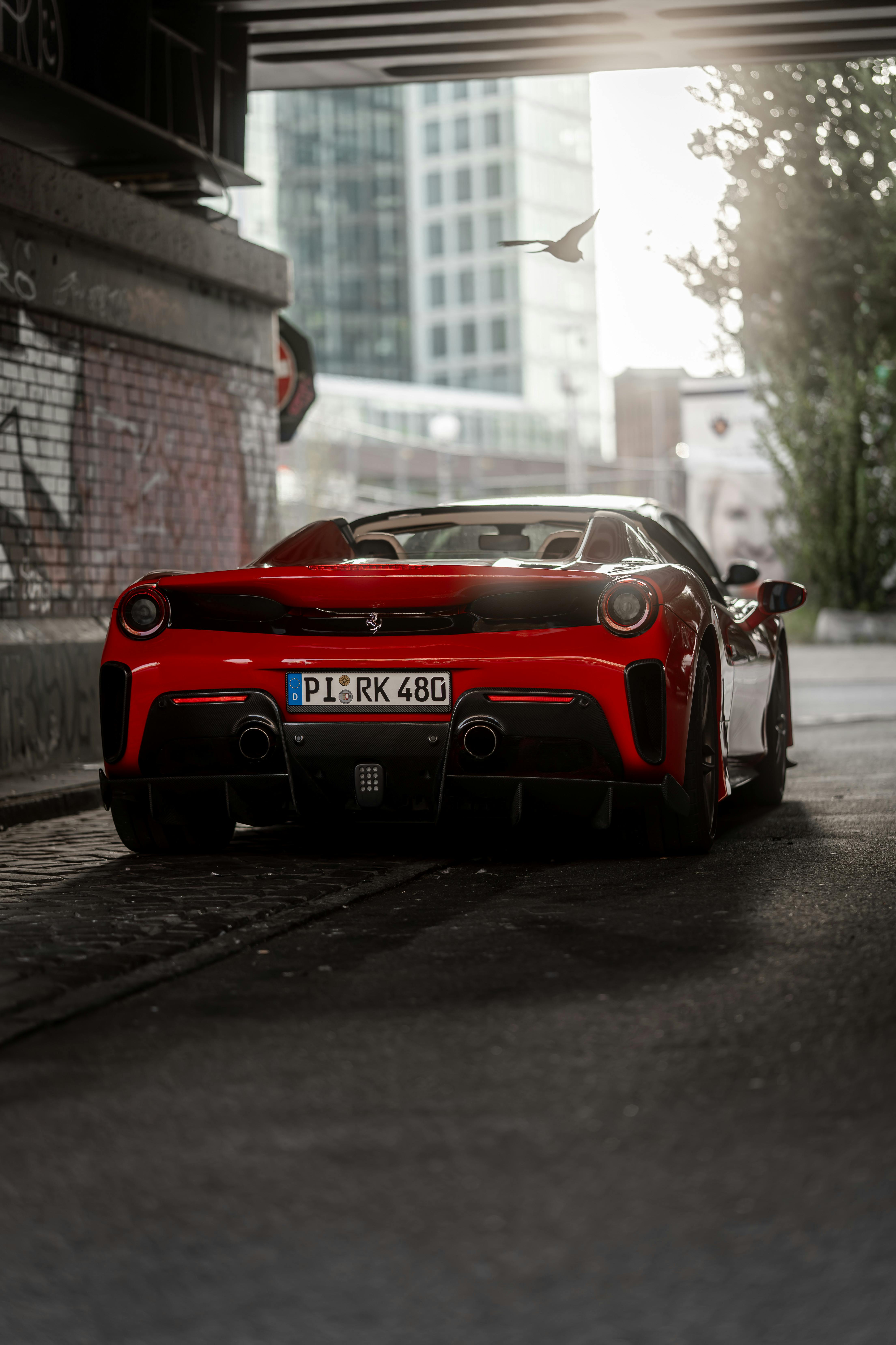 Free Stylish red Ferrari parked under an urban bridge in Hamburg ...