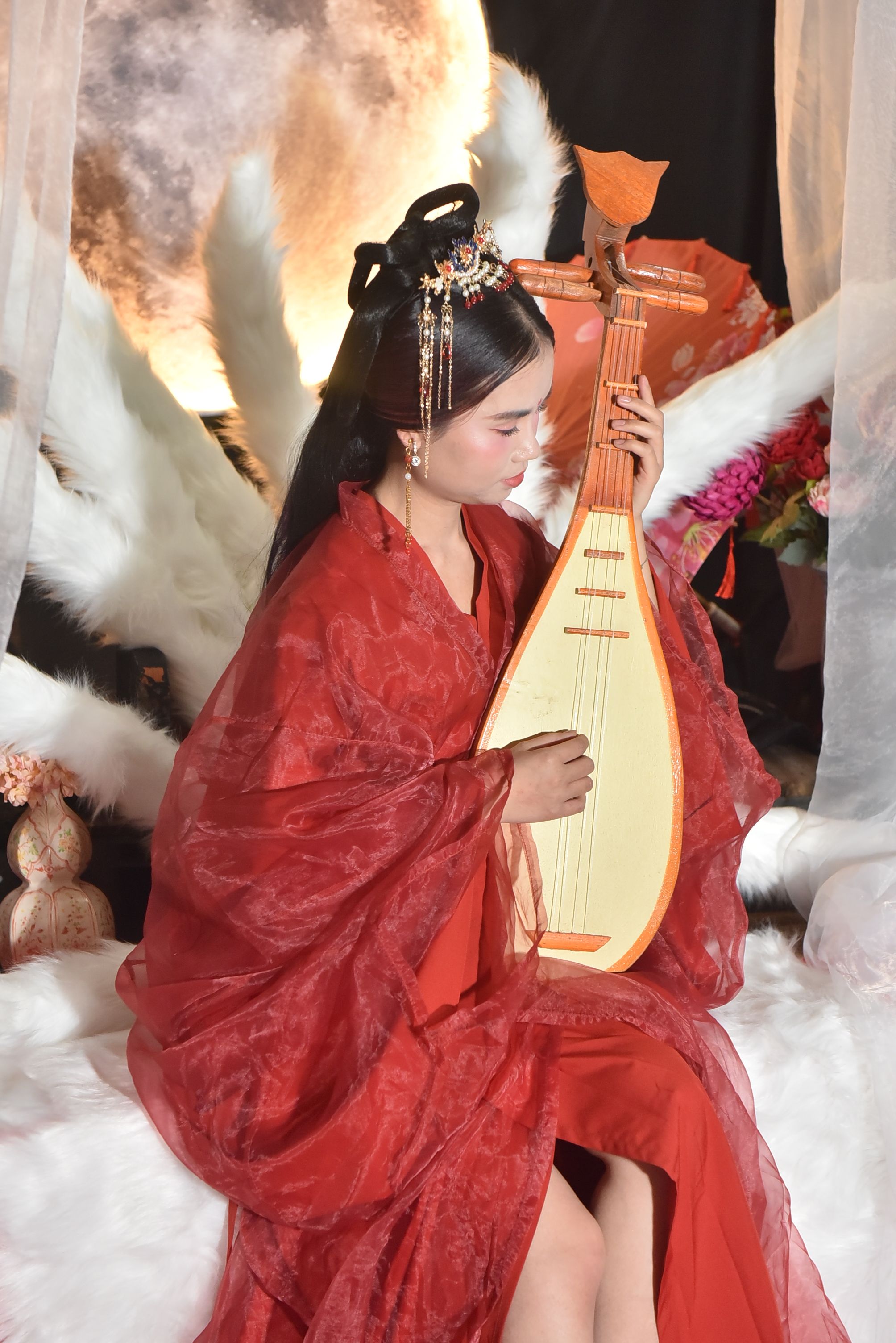 Serene Portrait of Woman in Red with Pipa Lute · Free Stock Photo