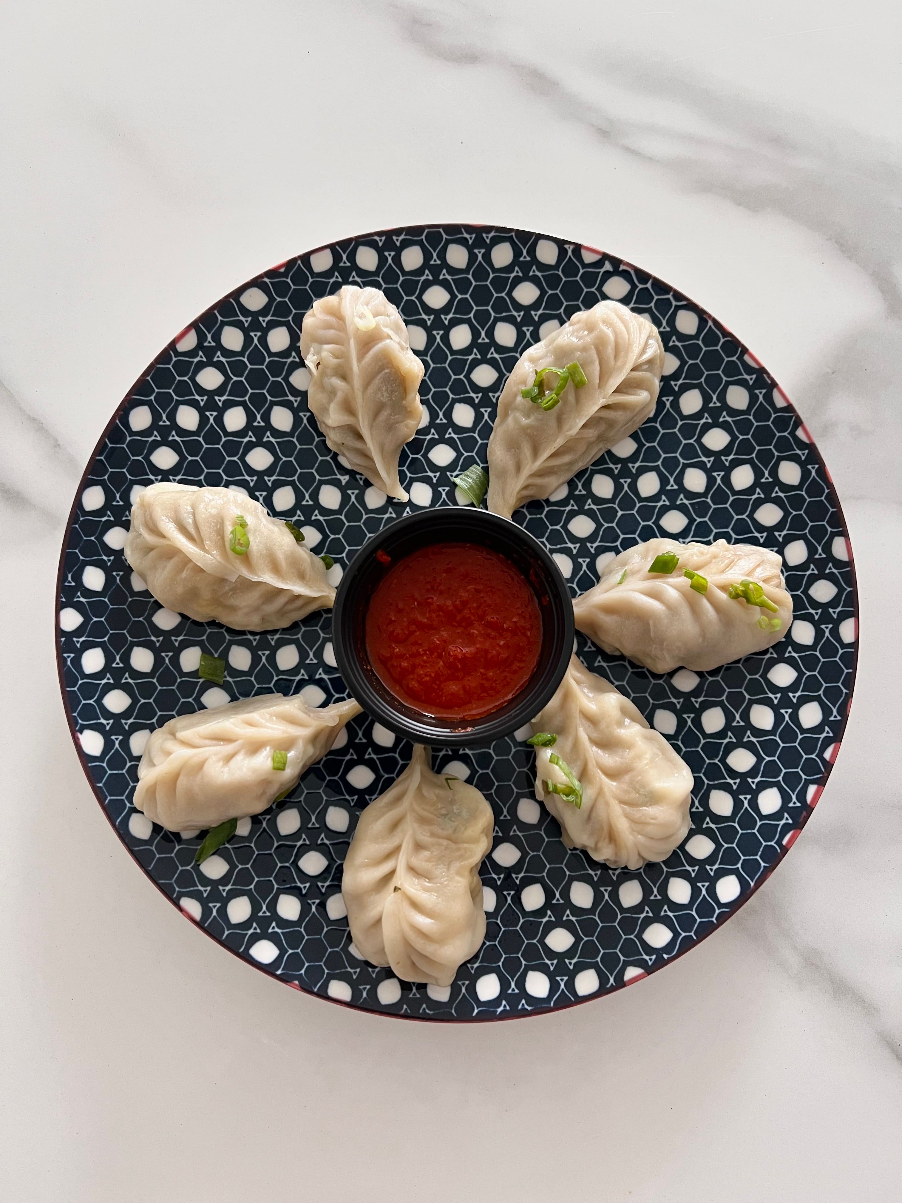 Artistic Presentation of Momos with Sauce · Free Stock Photo