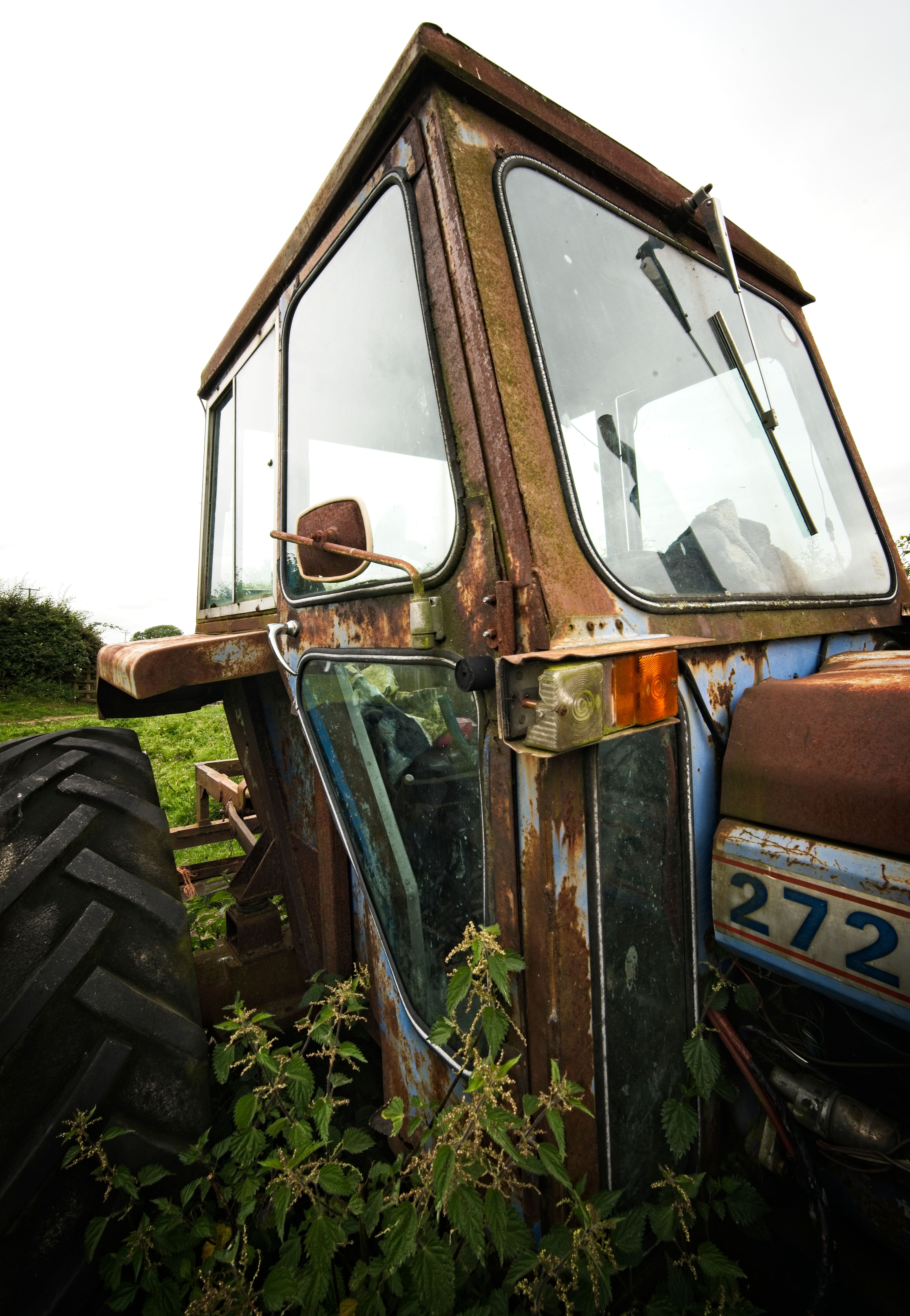 Rusty Vintage Tractor in Overgrown Pasture · Free Stock Photo