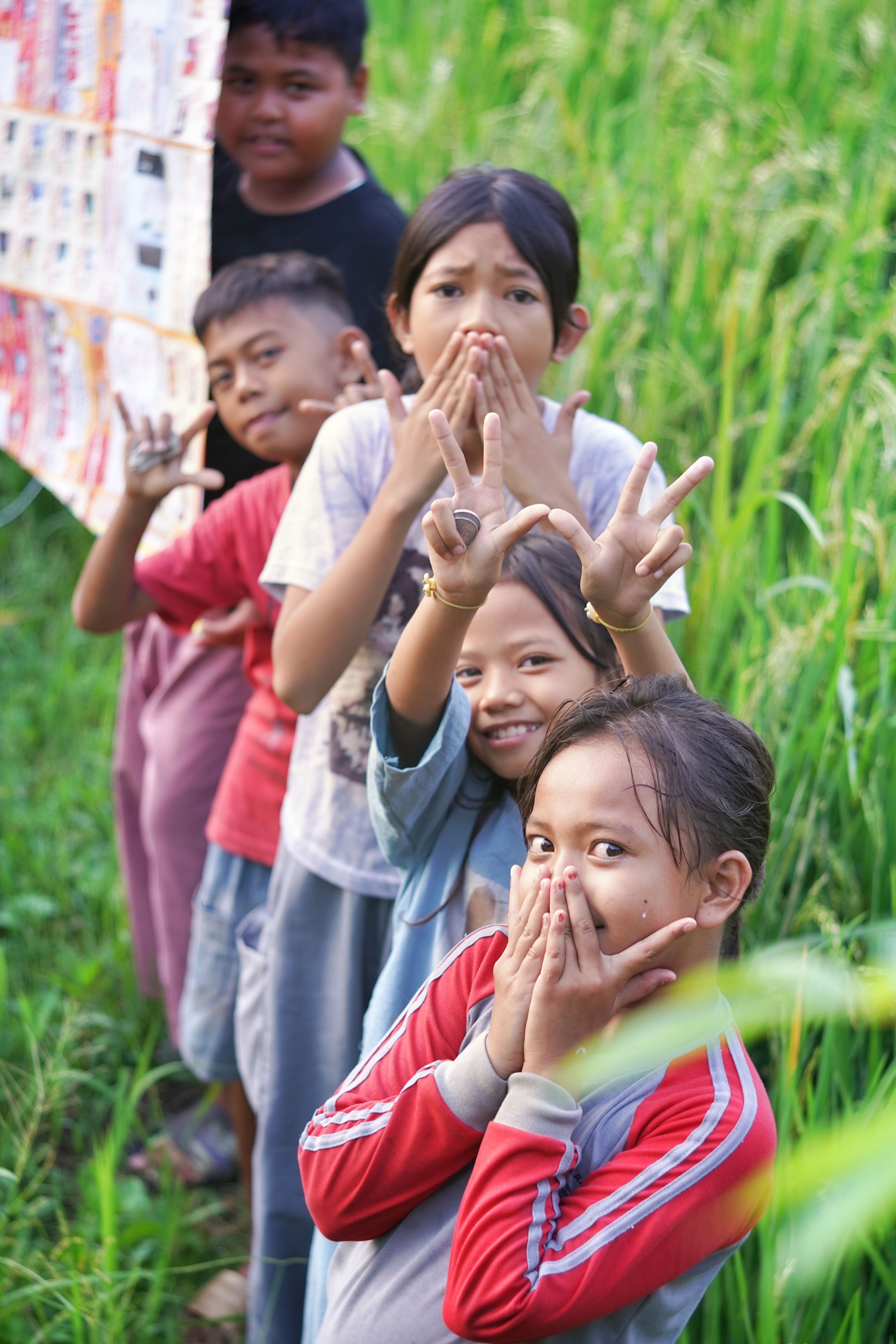 Joyful Children Playing in West Java Field · Free Stock Photo