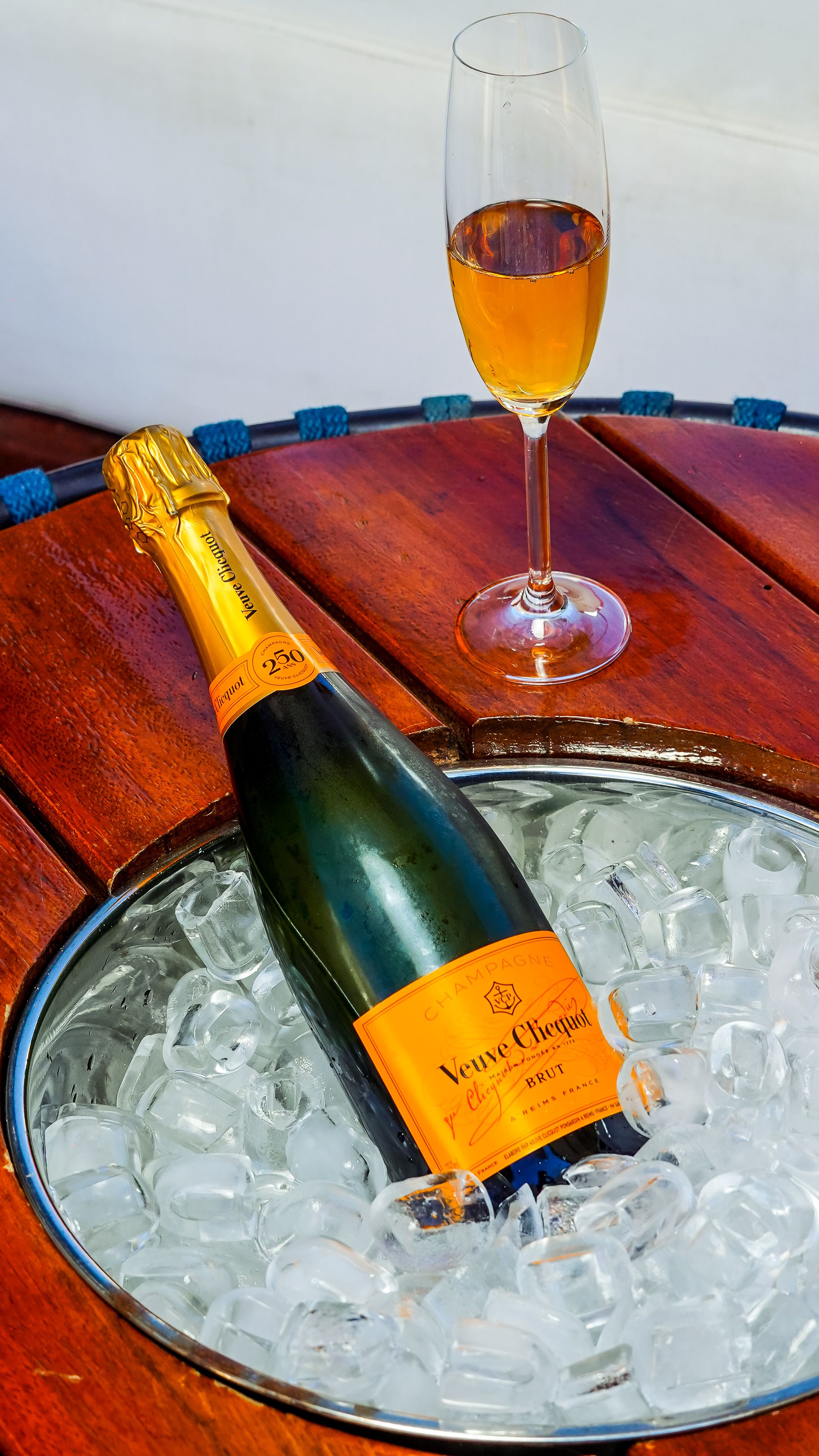 Chilled Champagne Bottle and Glass on Ice · Free Stock Photo