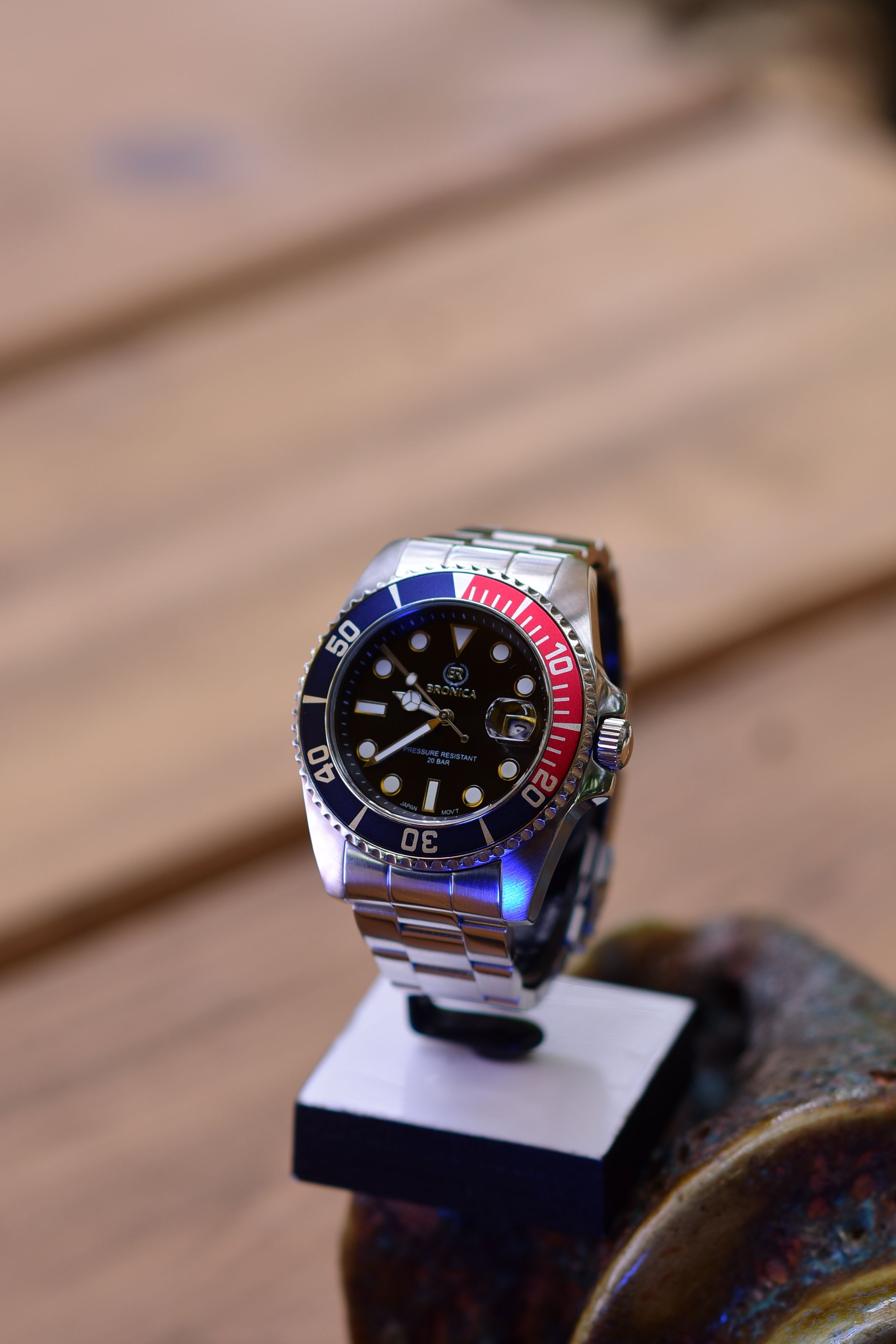 Luxury Silver and Black Dive Watch on Display · Free Stock Photo
