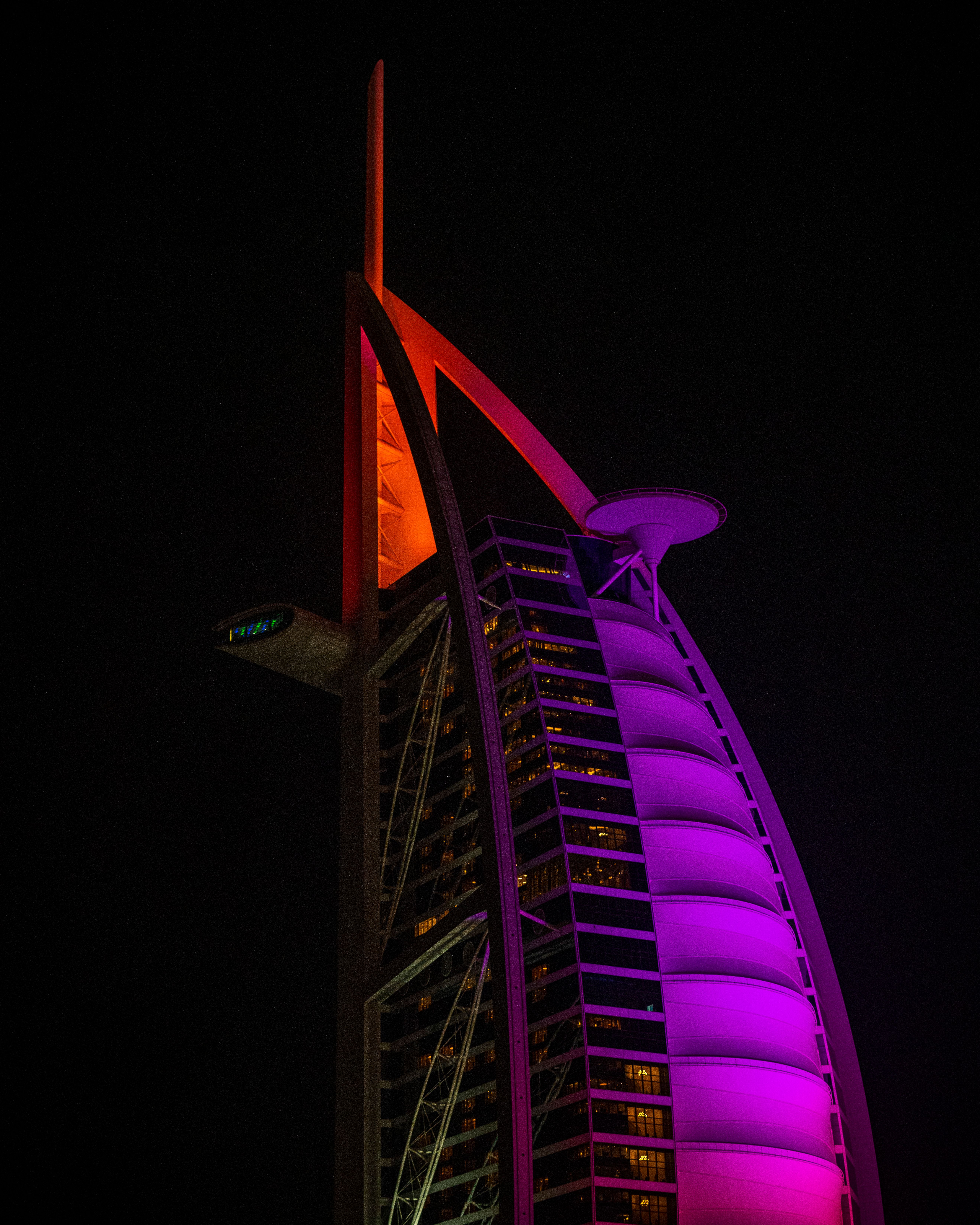 Illuminated Burj Al Arab Skyscraper in Dubai at Night · Free Stock Photo