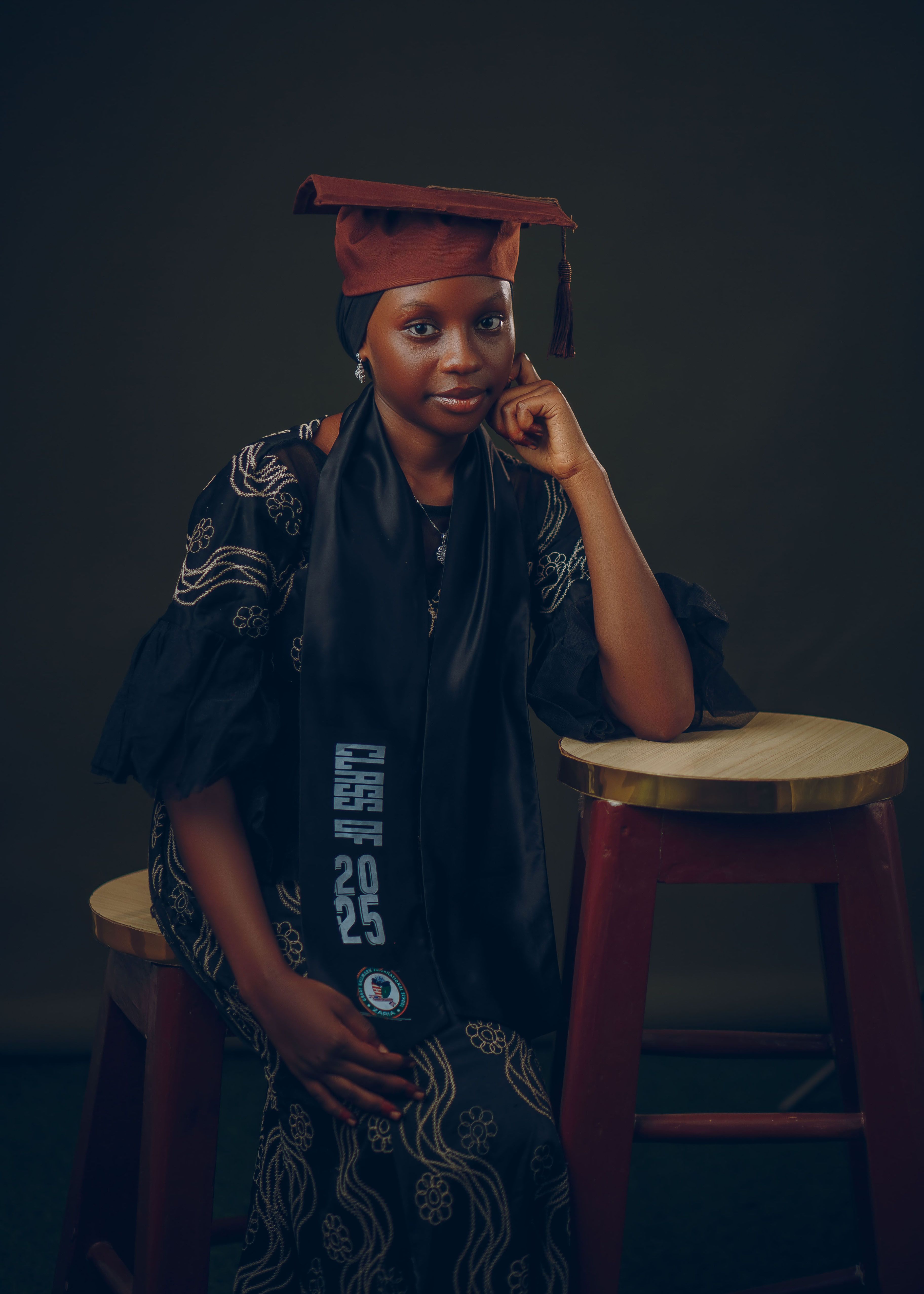 Beautiful Female Graduate in Traditional Attire · Free Stock Photo