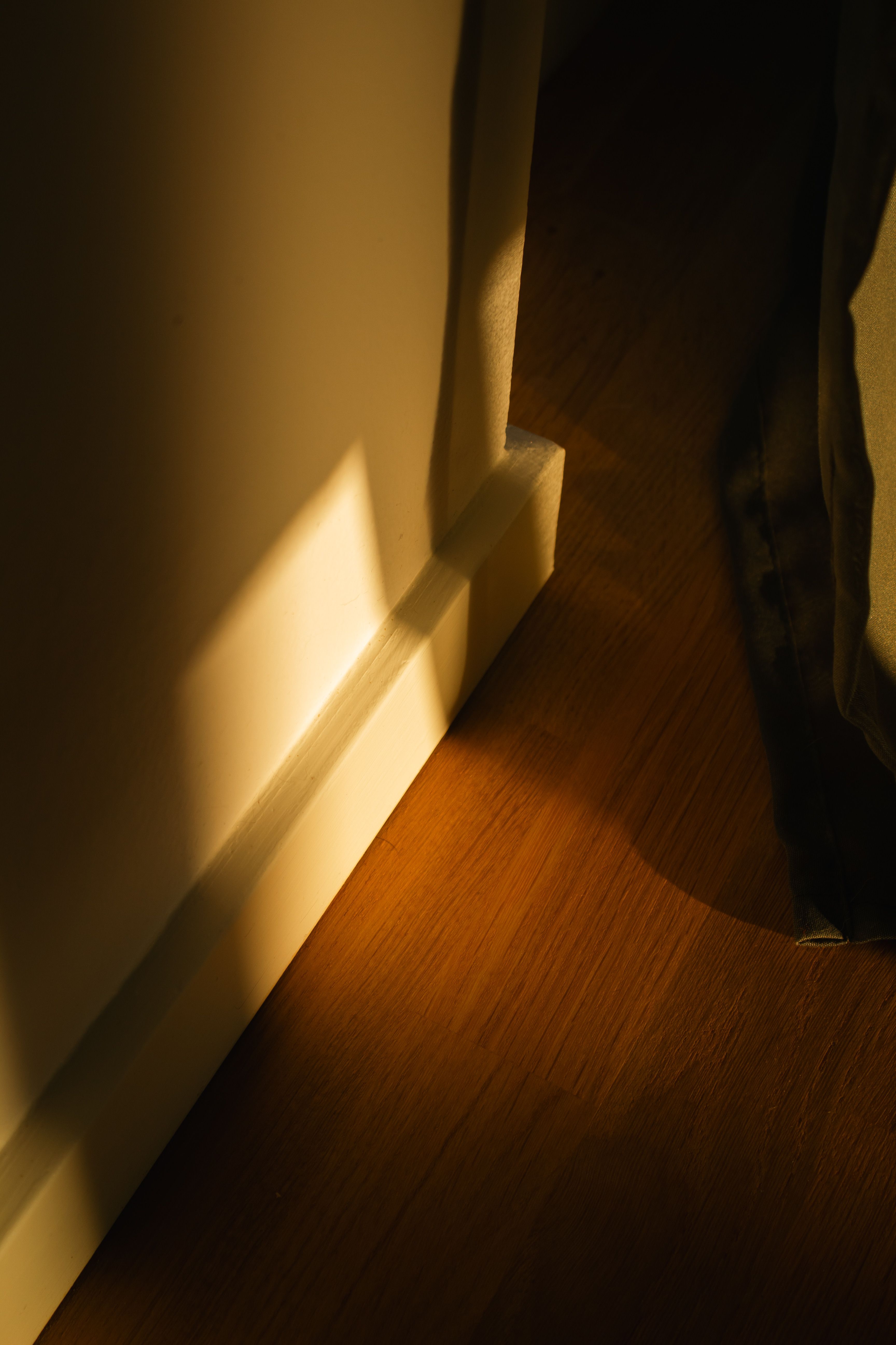 Warm Sunlight Casting Shadows on Wooden Floor · Free Stock Photo