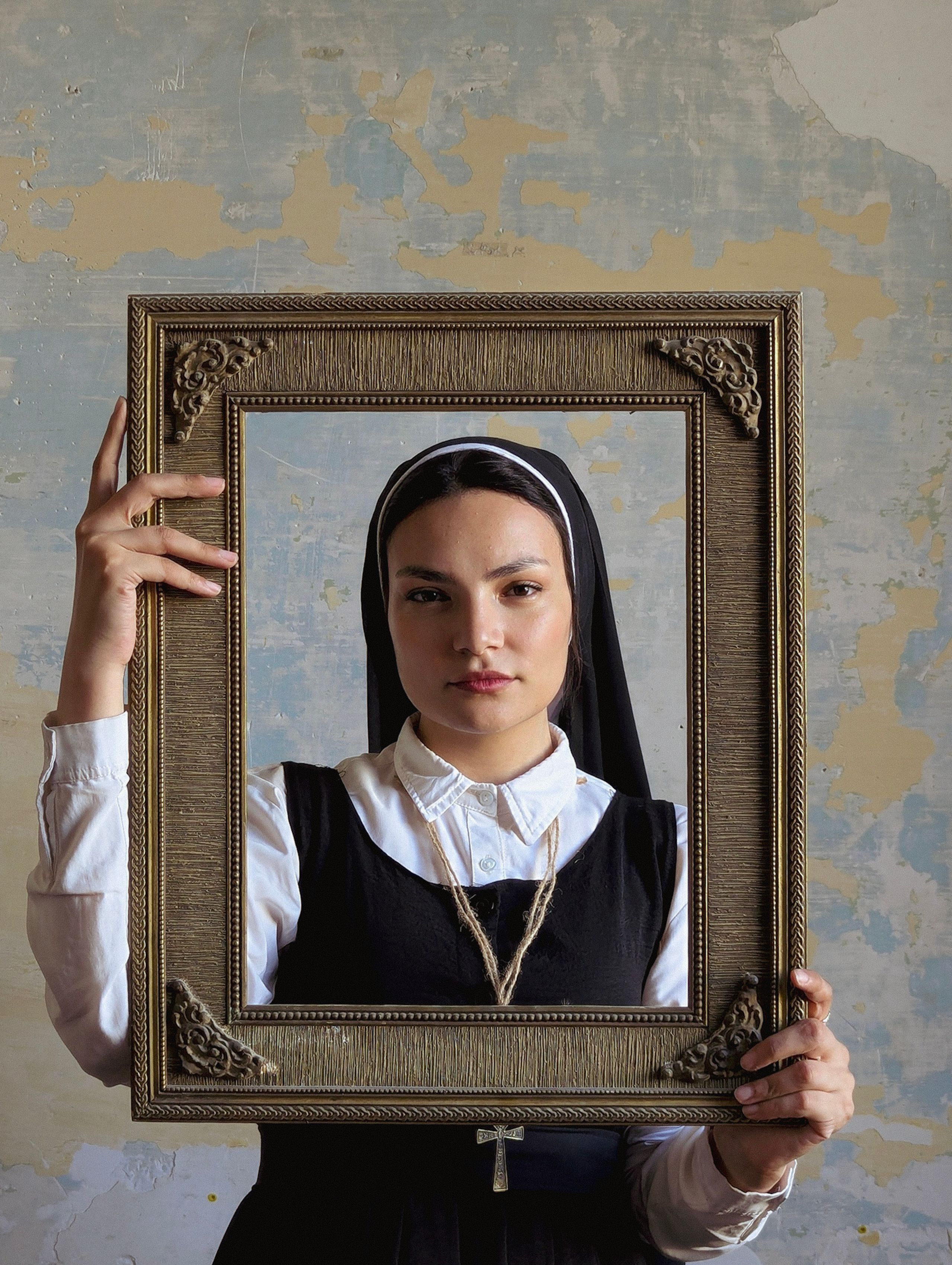 Young Woman Posing with Ornate Picture Frame · Free Stock Photo