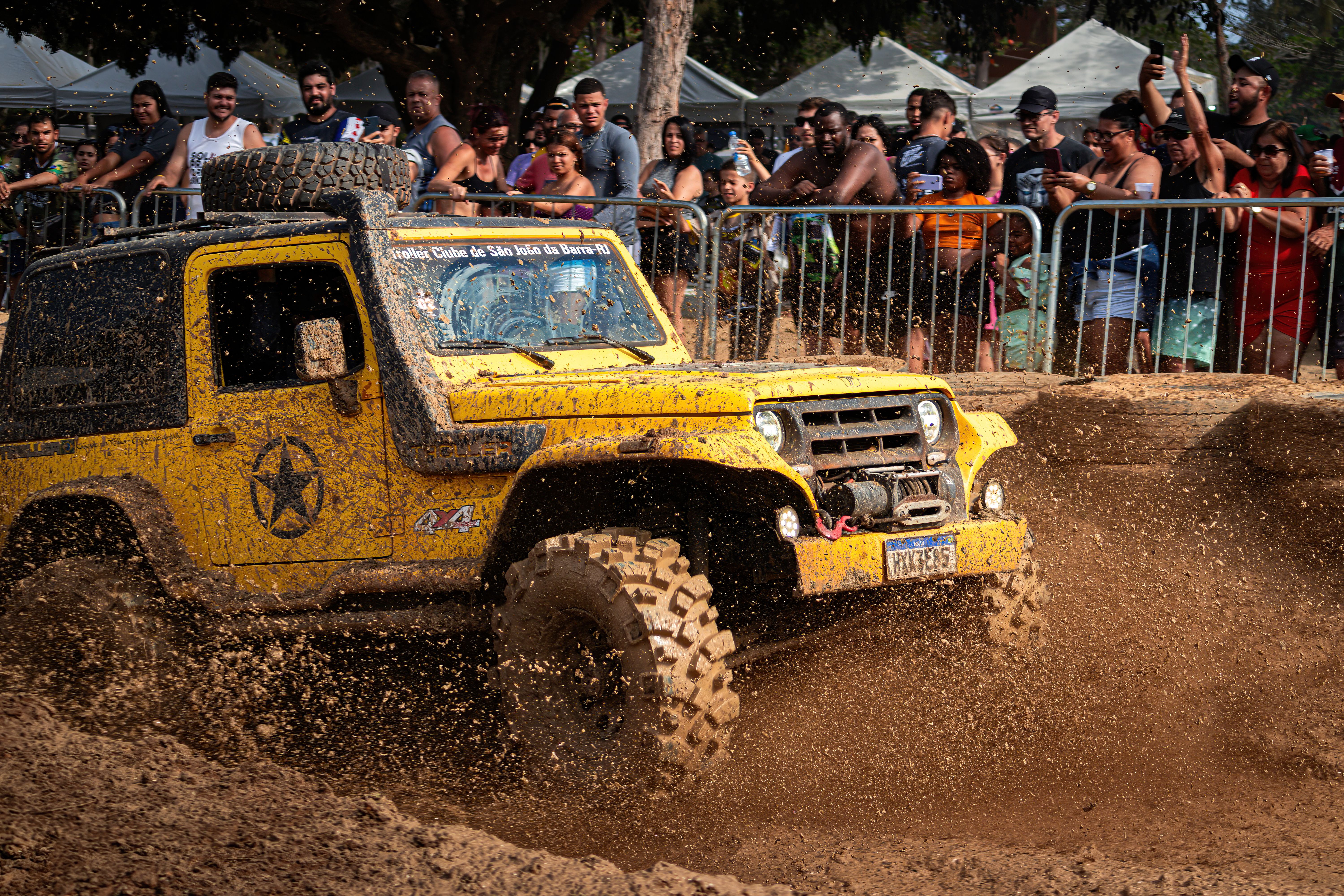 Yellow Off-Road Vehicle in Action at Mud Racing Event · Free Stock Photo