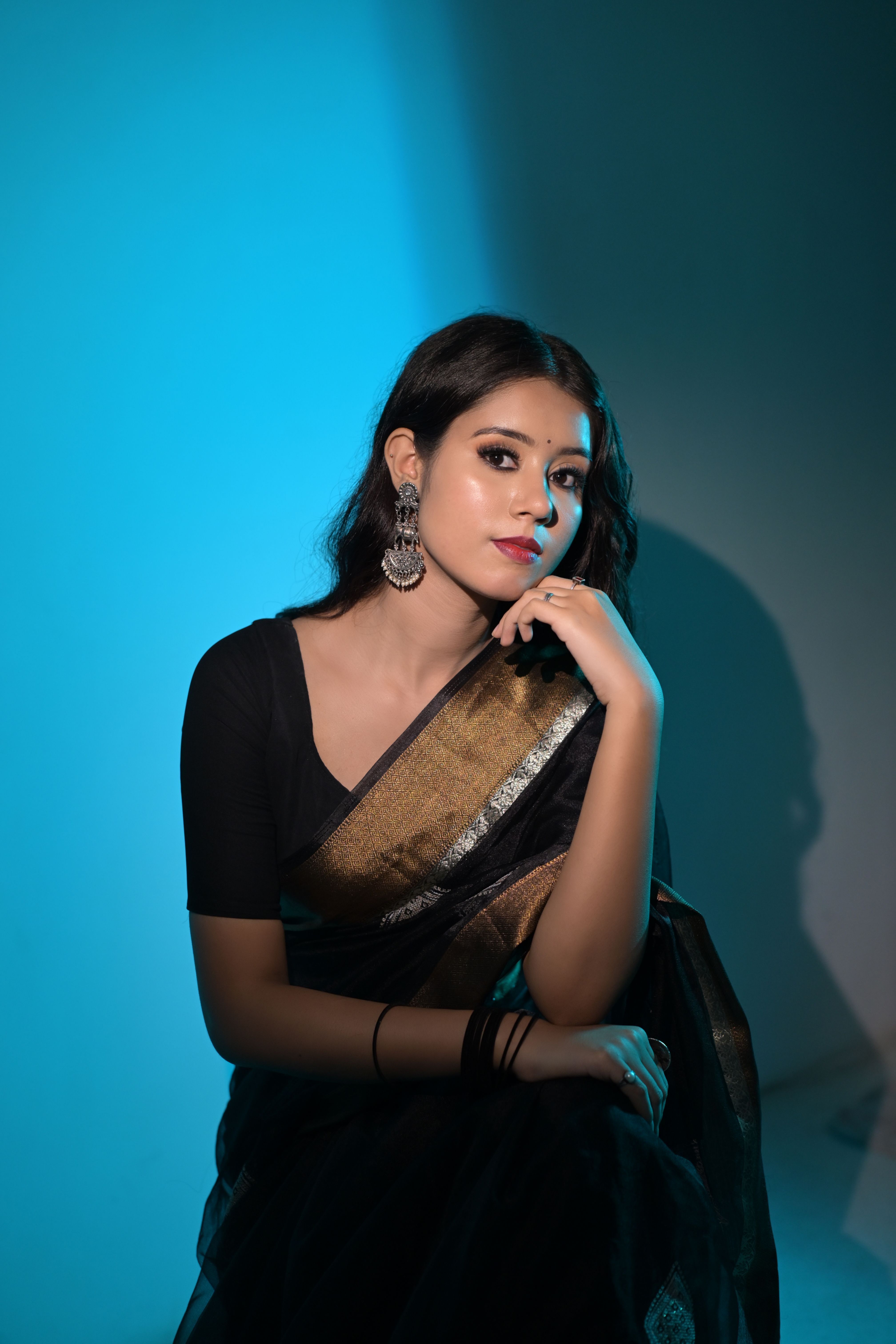 Charming Indian Woman in Traditional Black Saree · Free Stock Photo