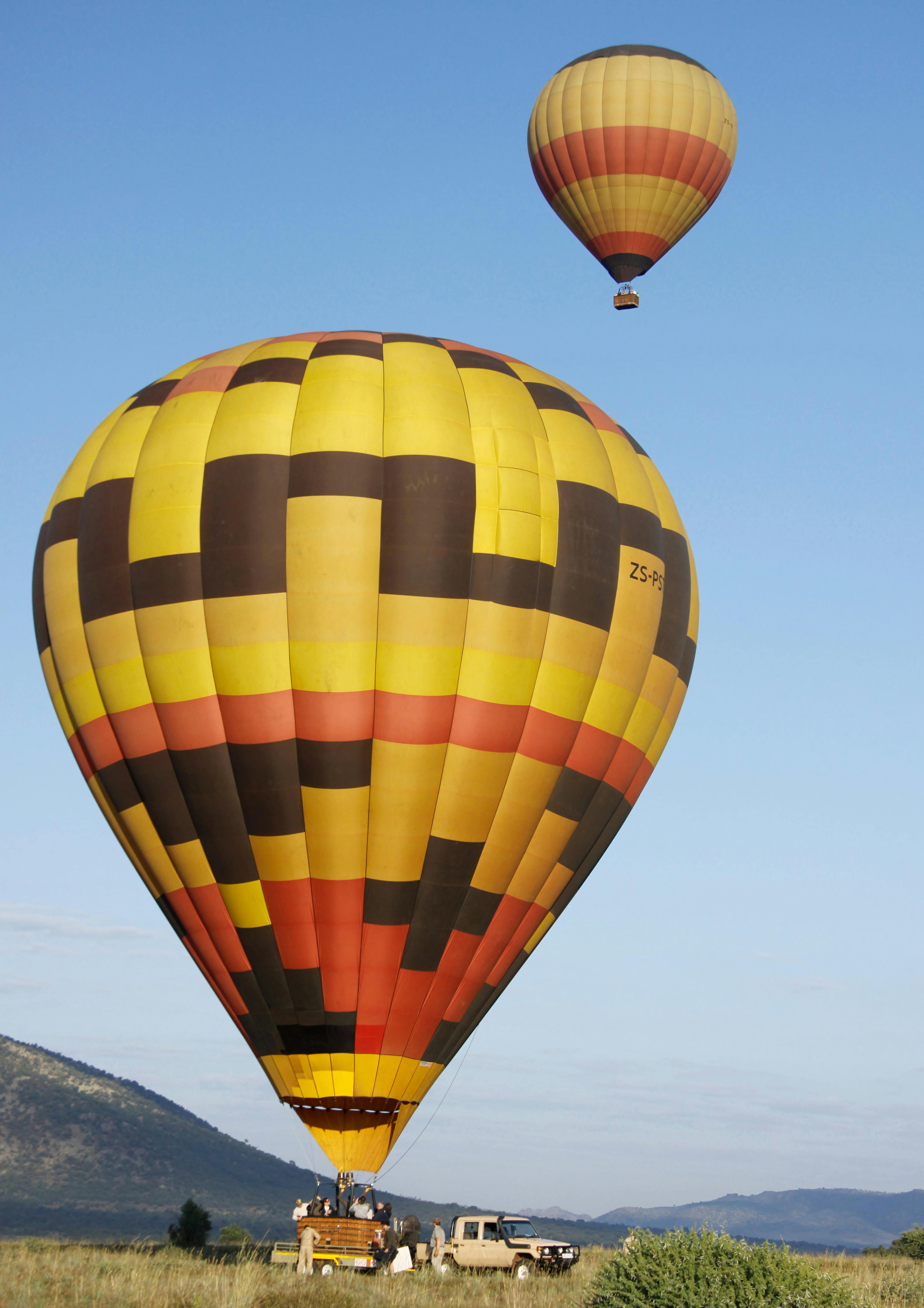 Free Colorful hot air balloons soar above a scenic landscape during a ...