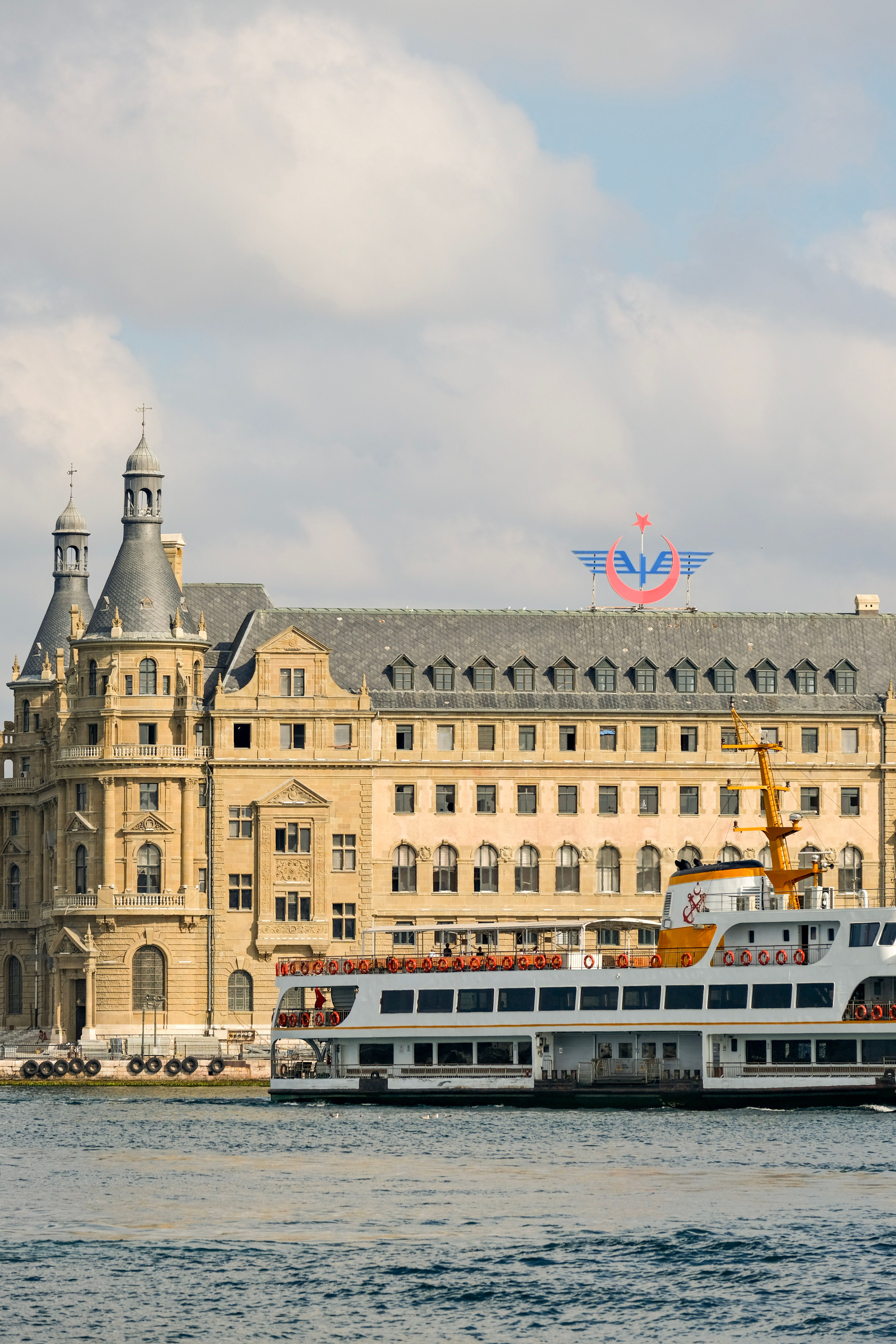 Historic Building and Ferry on Bosphorus in Istanbul · Free Stock Photo