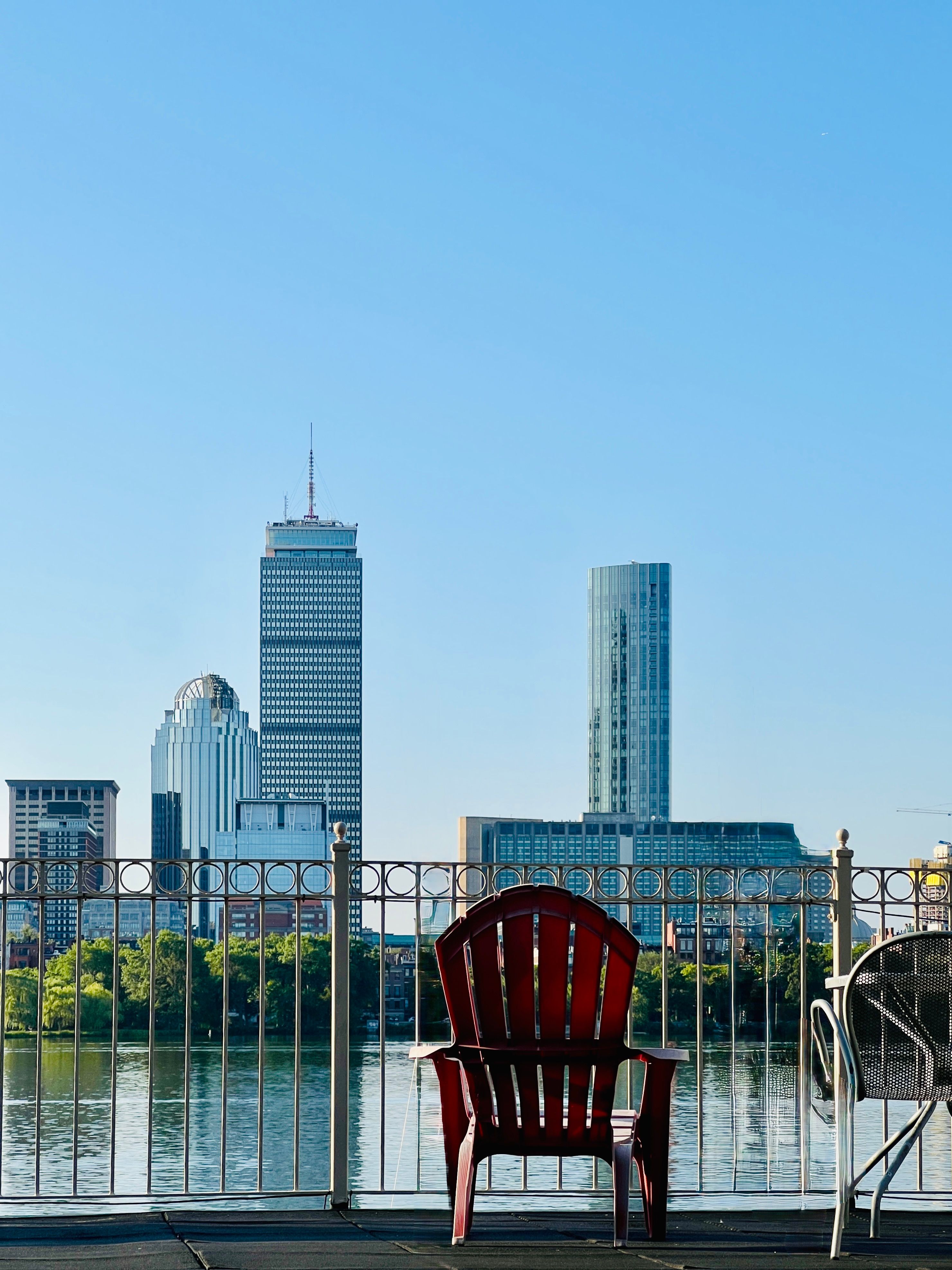 Boston Skyline from Waterfront with Red Chair · Free Stock Photo