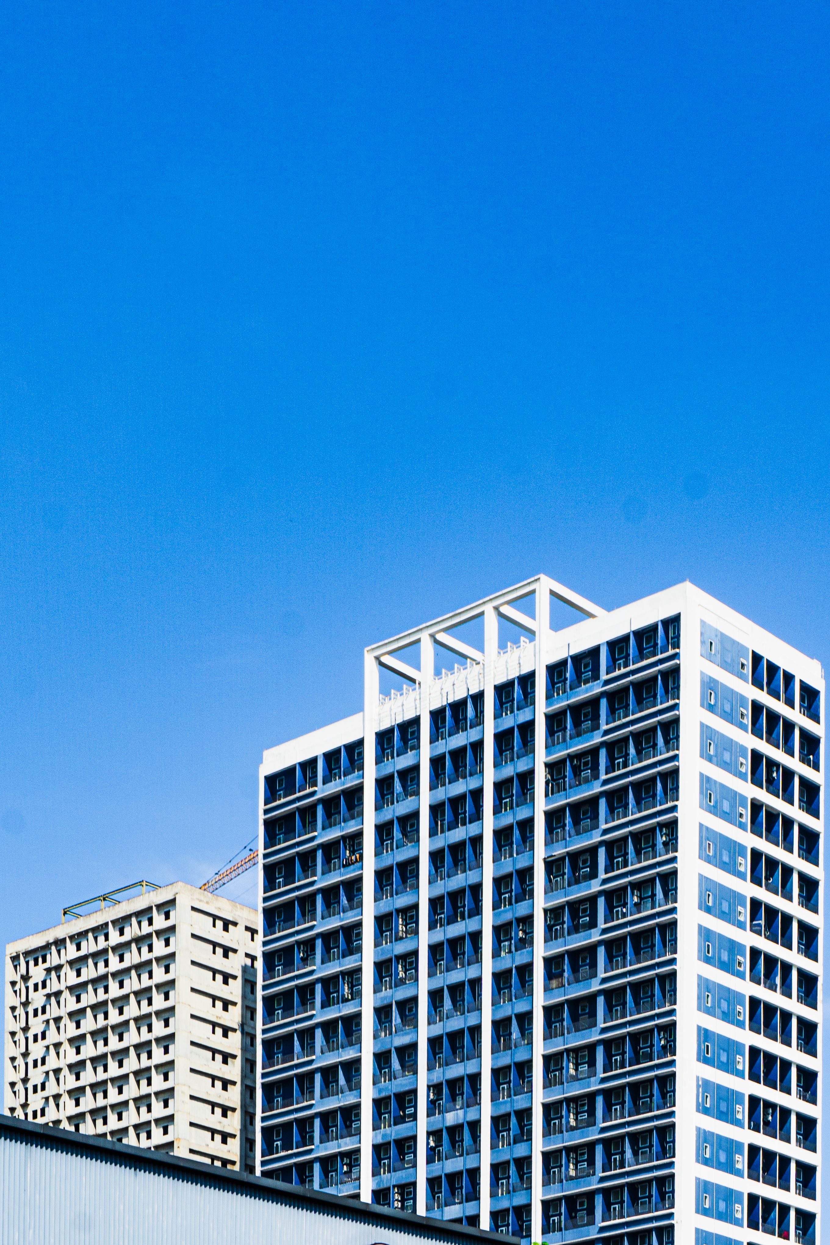 Modern Highrise Buildings Against Blue Sky · Free Stock Photo