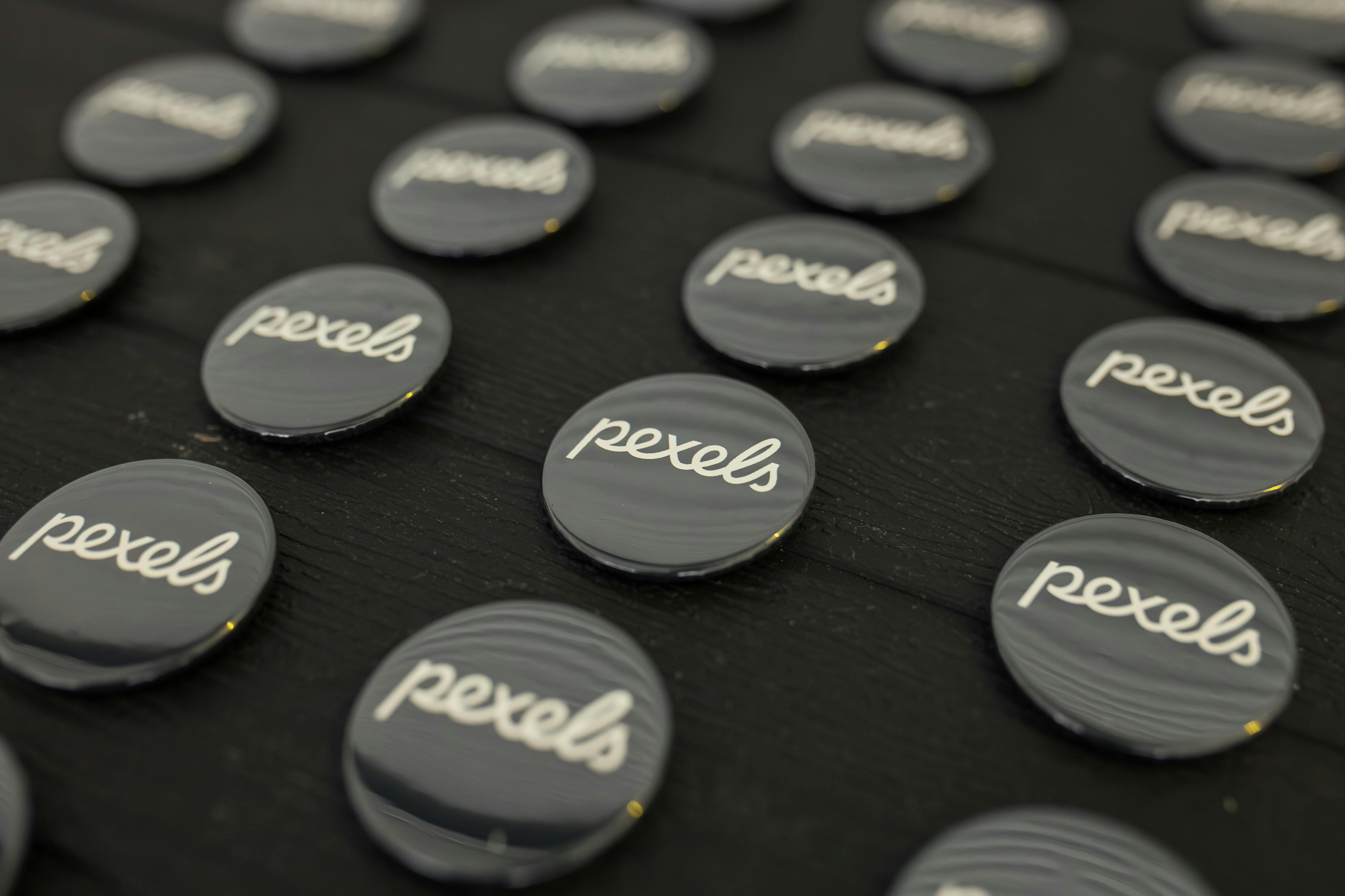 Array of Pexels Logo Buttons on Display · Free Stock Photo