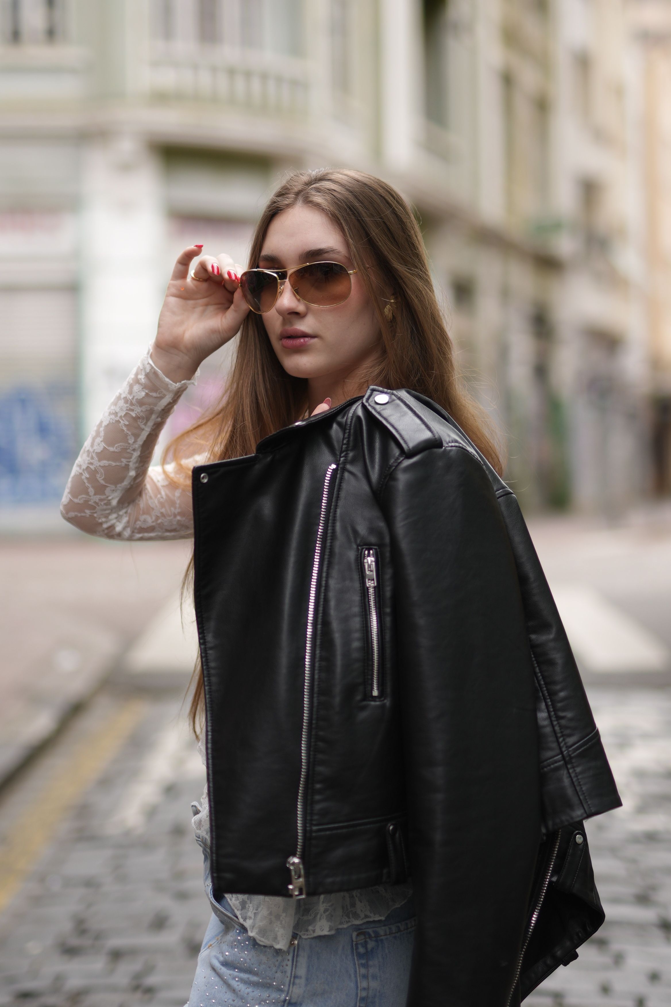 Fashionable Woman Posing in Urban Street Setting · Free Stock Photo