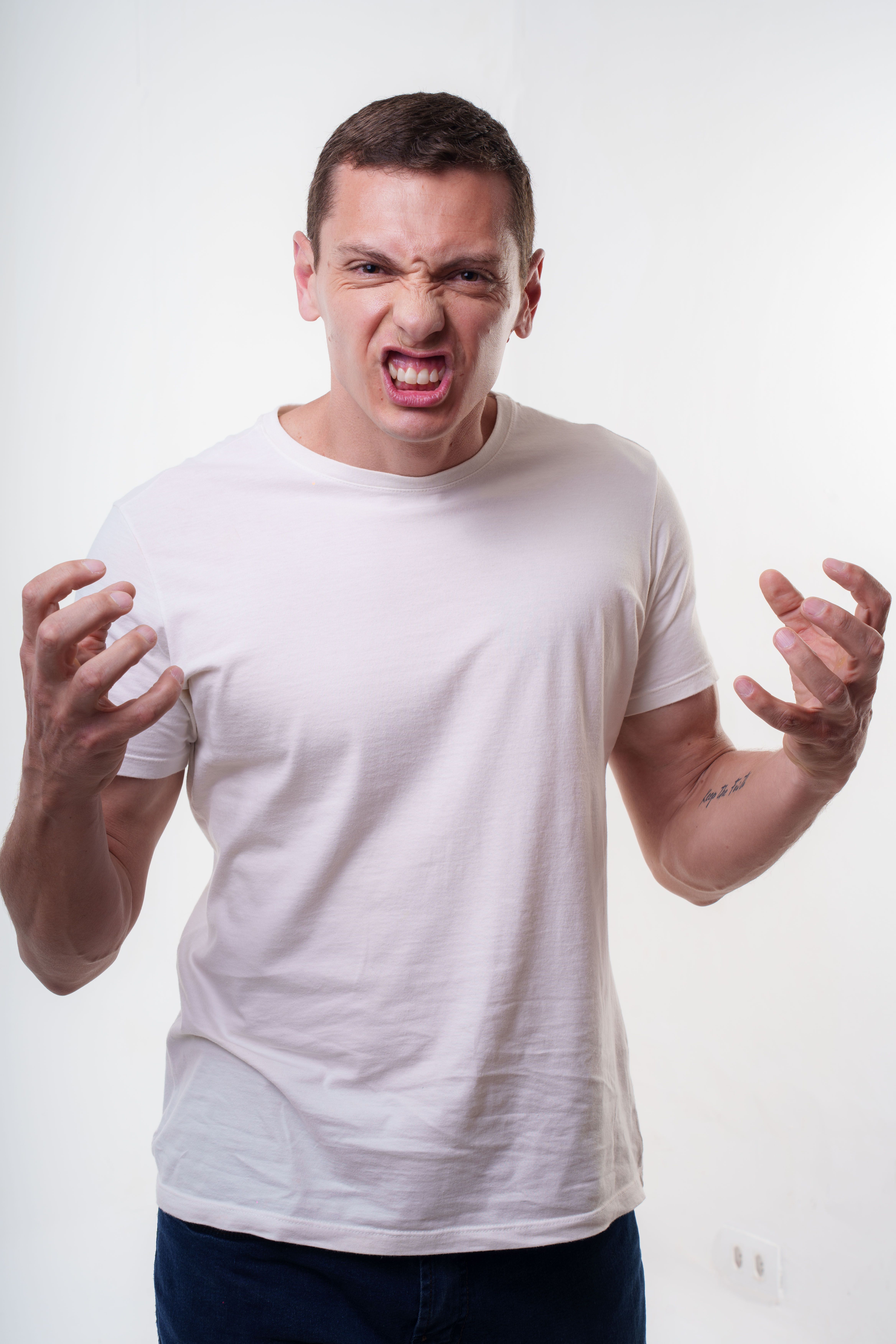 Angry Young Man Expressing Strong Emotions · Free Stock Photo