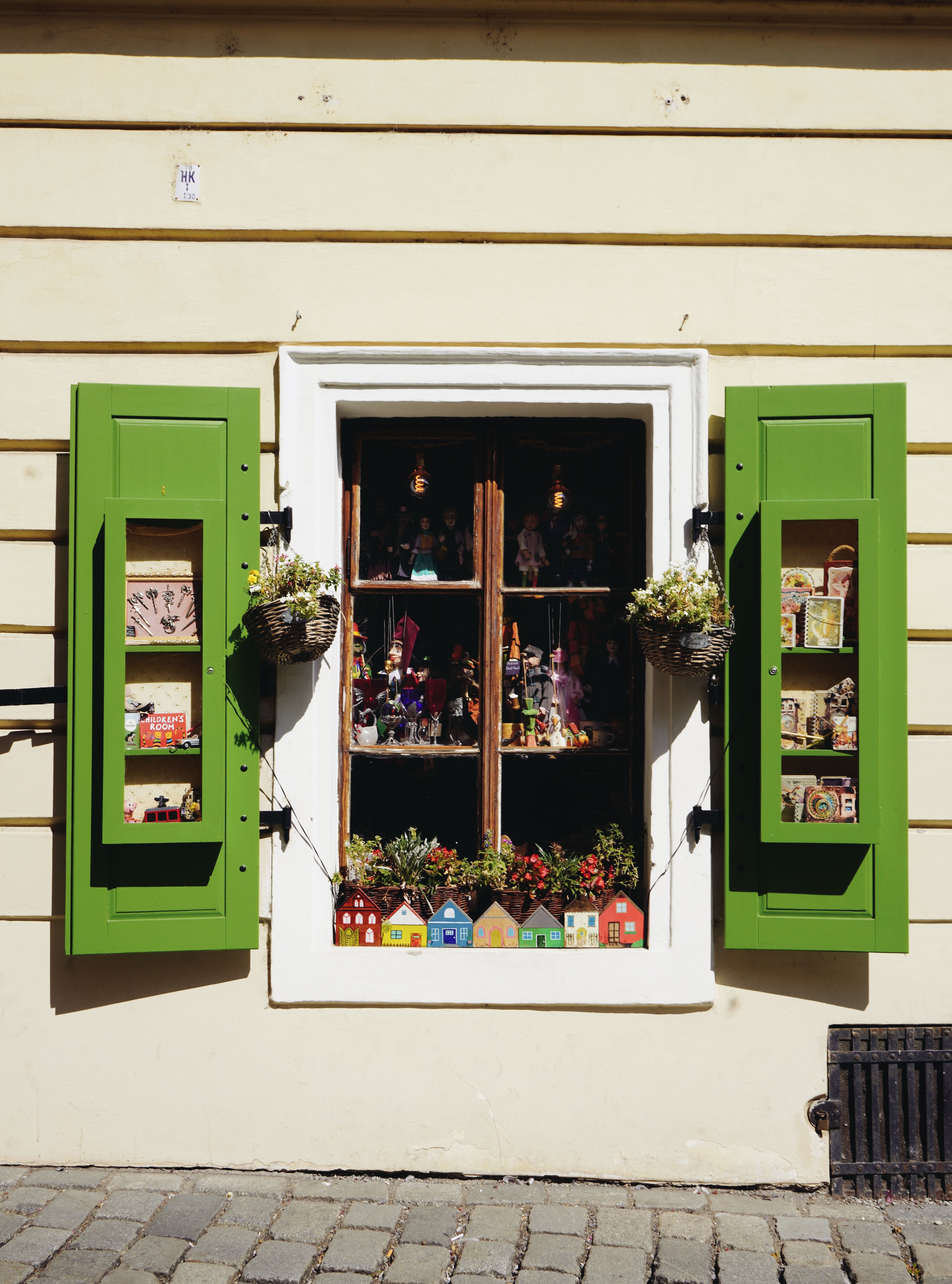Charming Window Display with Green Shutters · Free Stock Photo