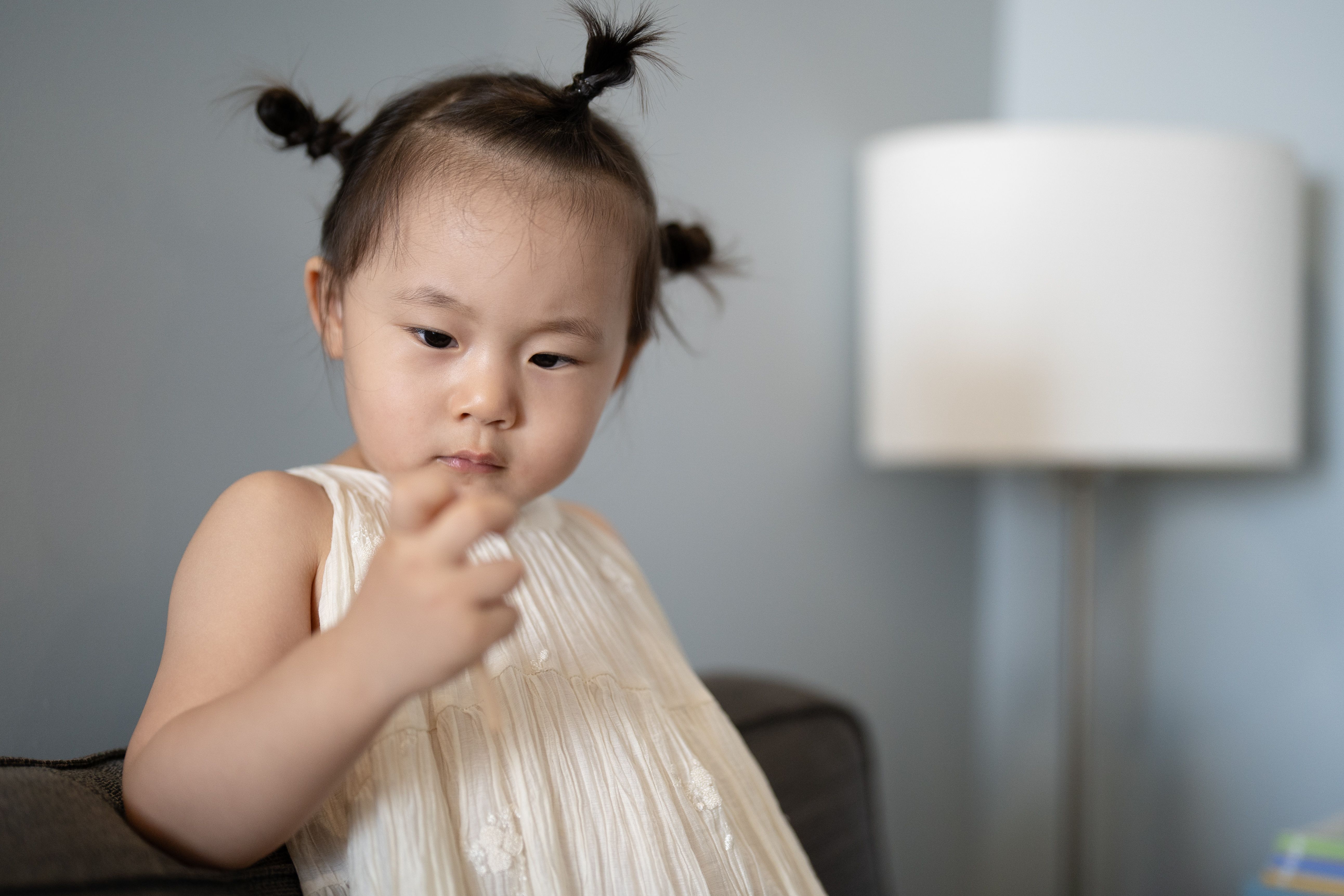 Adorable Child with Cute Hairstyle Indoors · Free Stock Photo