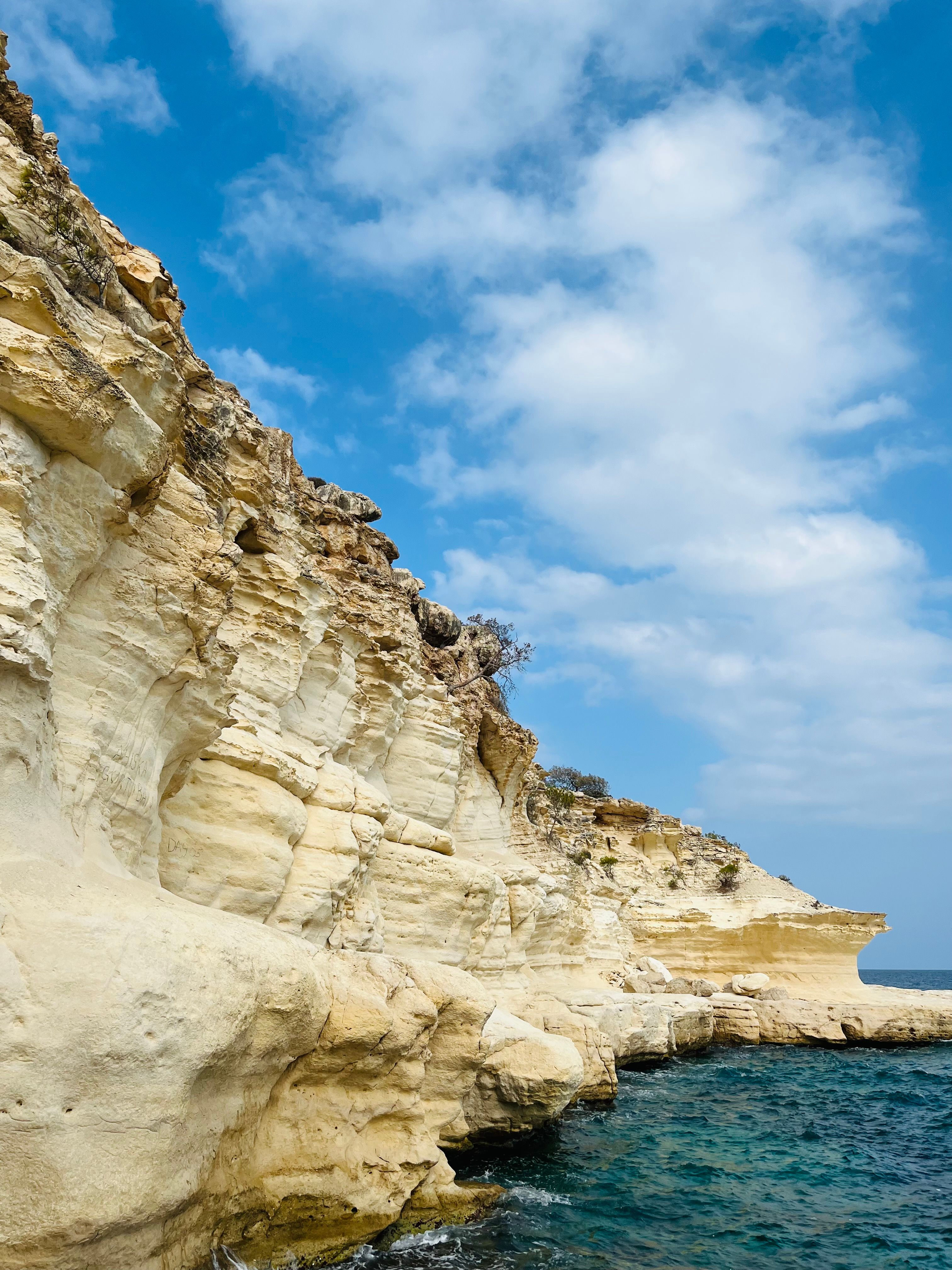 Sandstone in Blue Sea and Horizon · Free Stock Photo