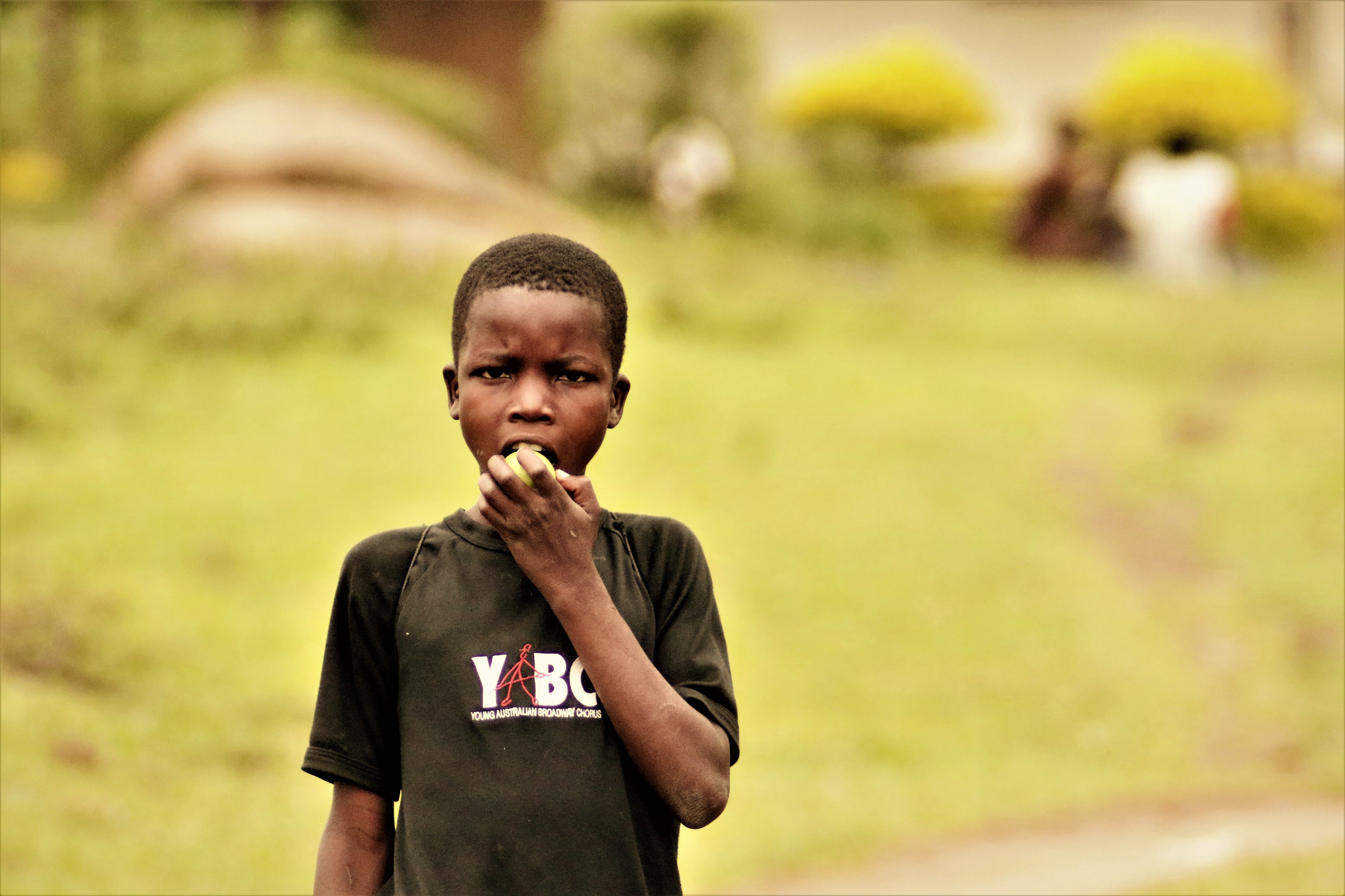 Young African Child Running In The Fields In Rural Uganda Photos ...