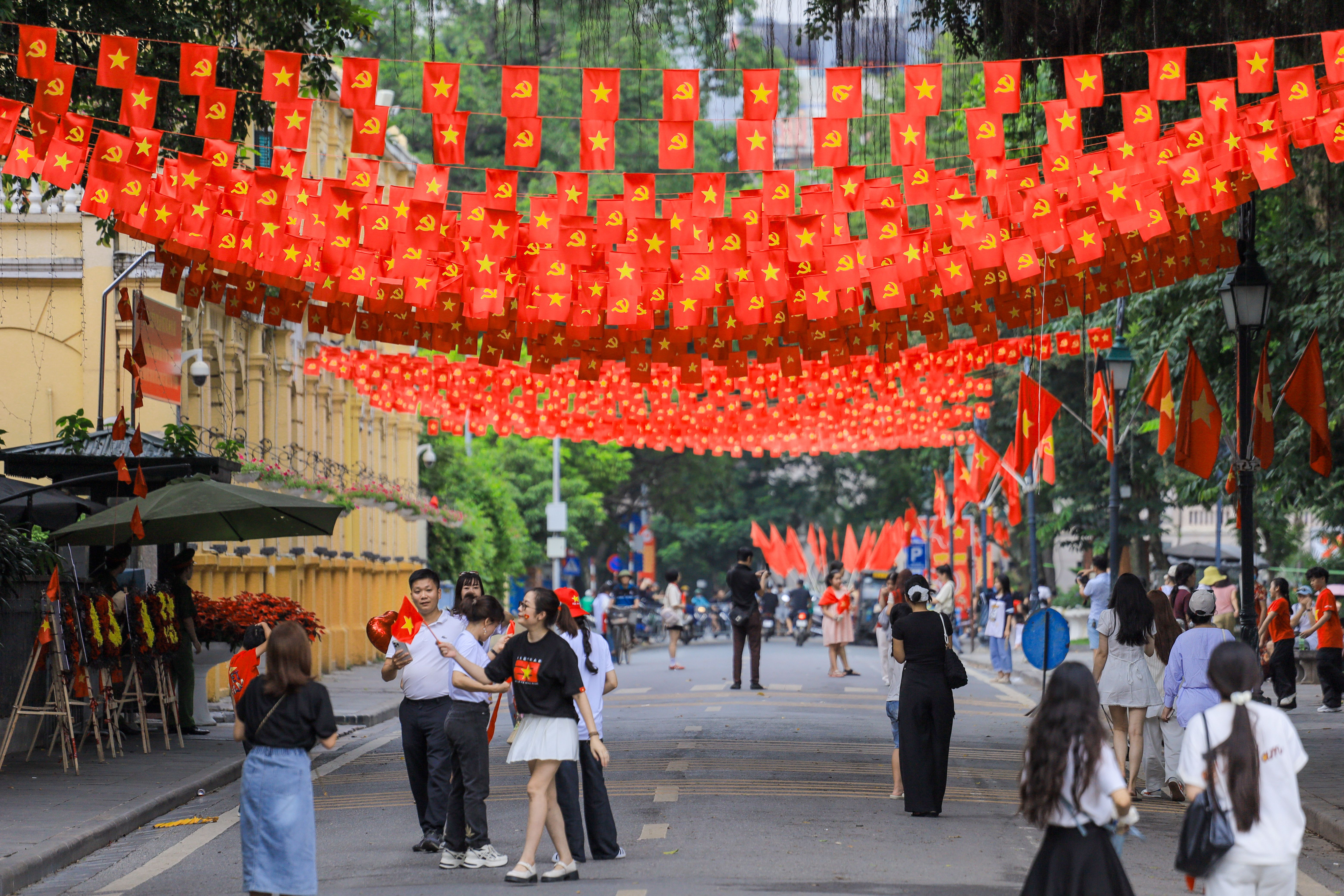 Street Celebration in Hanoi with Vibrant Flags · Free Stock Photo