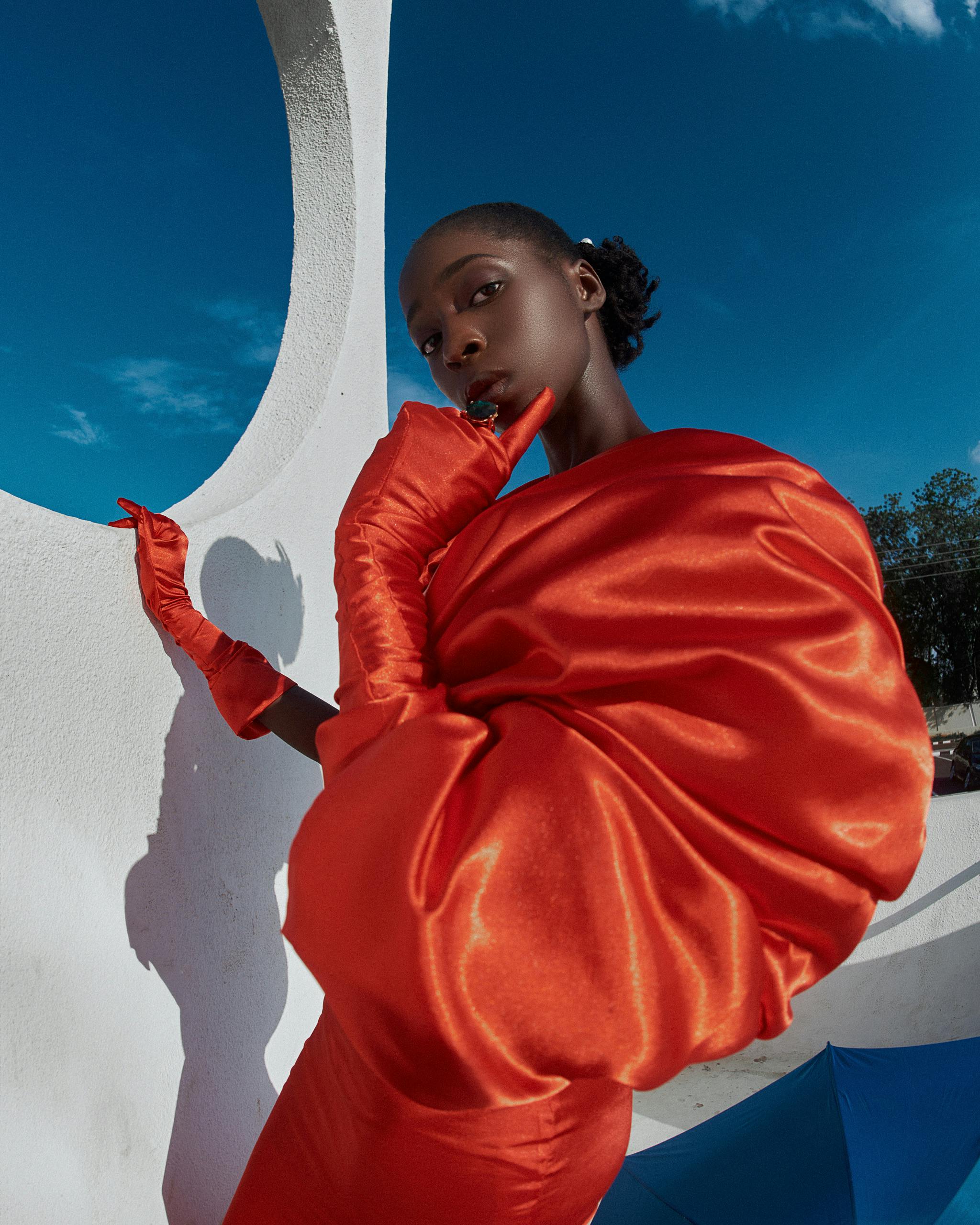 Fashionable Portrait in Red Satin Gown Outdoors · Free Stock Photo