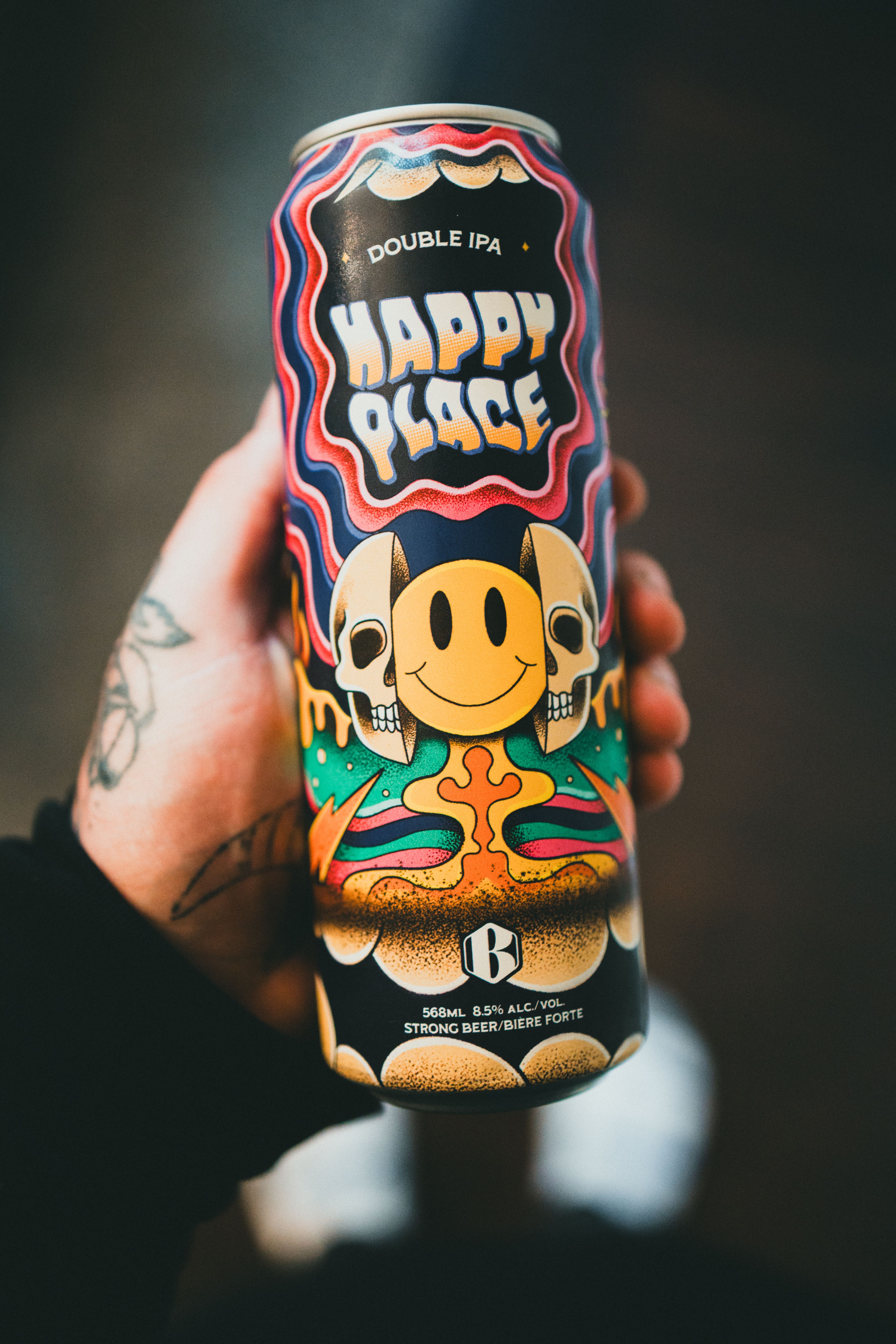Vibrant Happy Place IPA Beer Can with Tattoos · Free Stock Photo