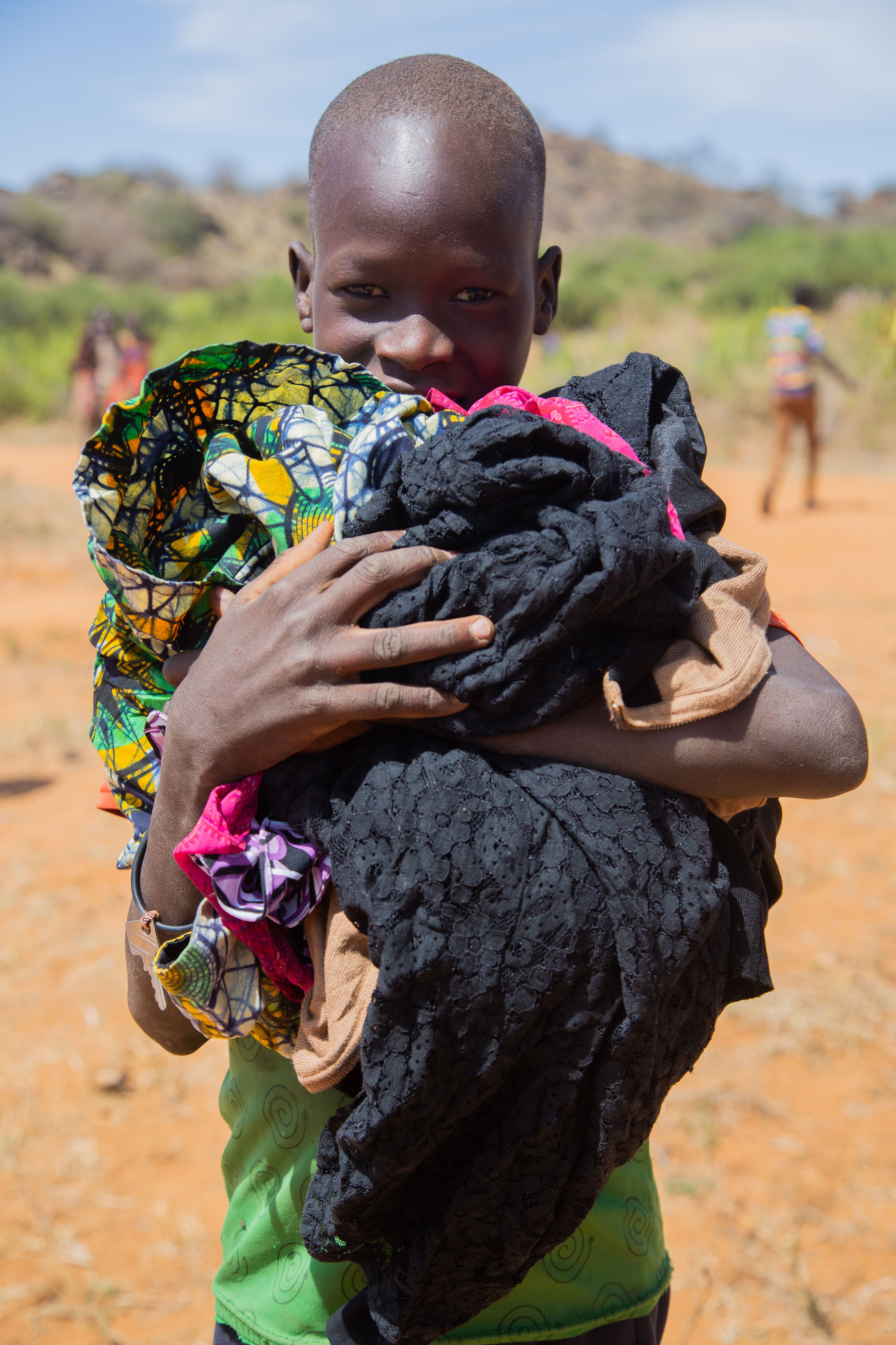 Young Boy Holding Baby Goat · Free Stock Photo