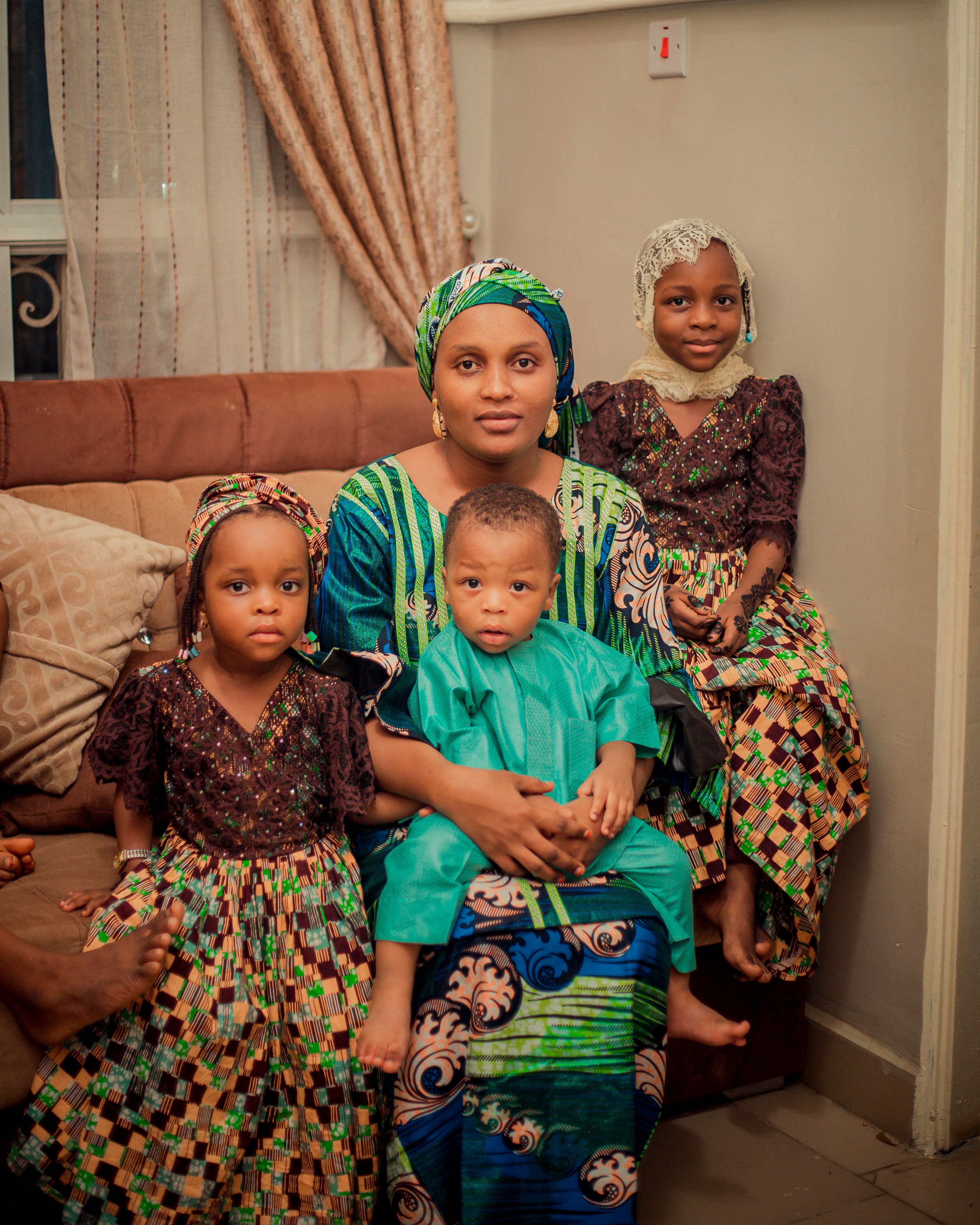 Family Portrait with Traditional Clothing · Free Stock Photo
