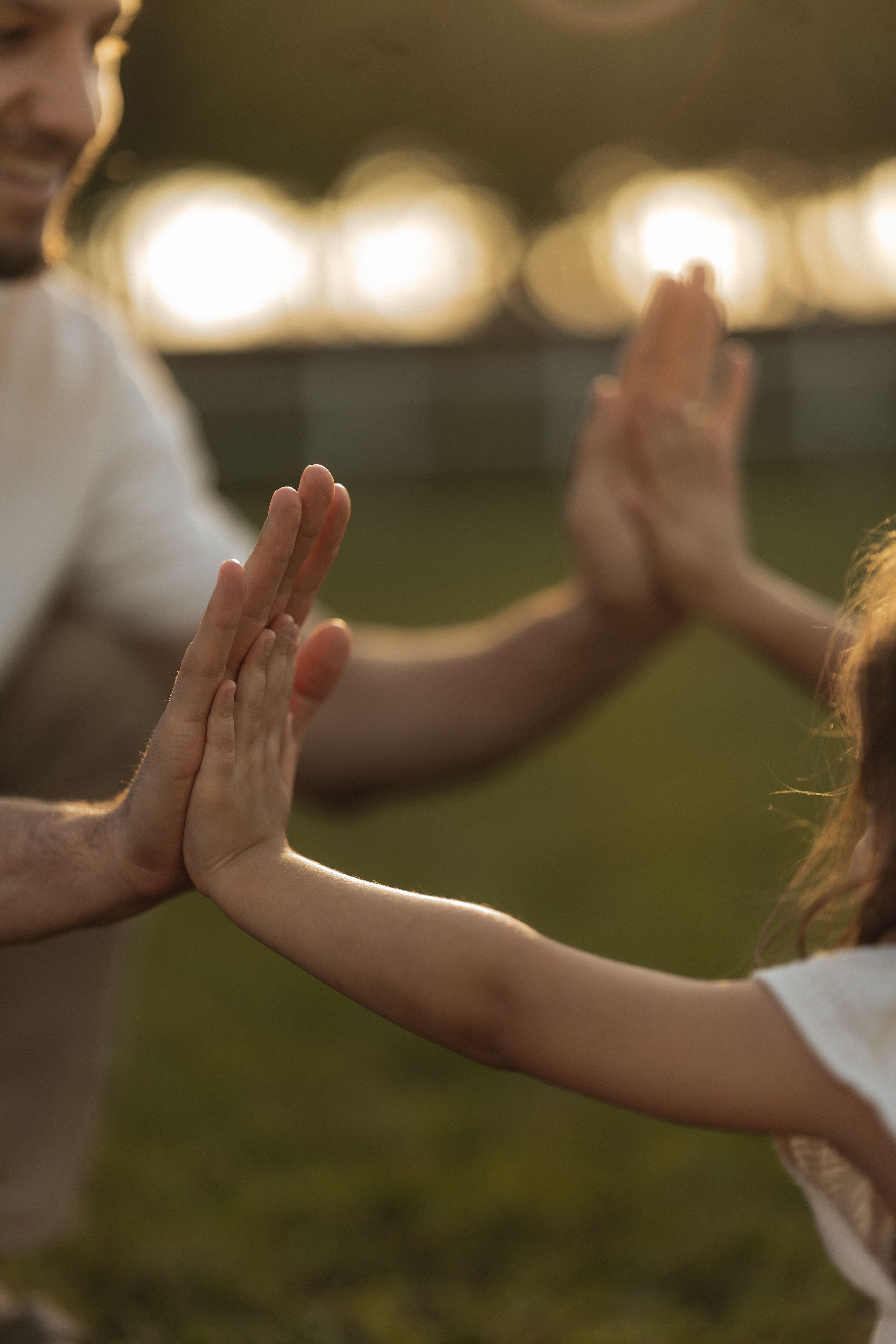 Father and Child High Five at Sunset · Free Stock Photo