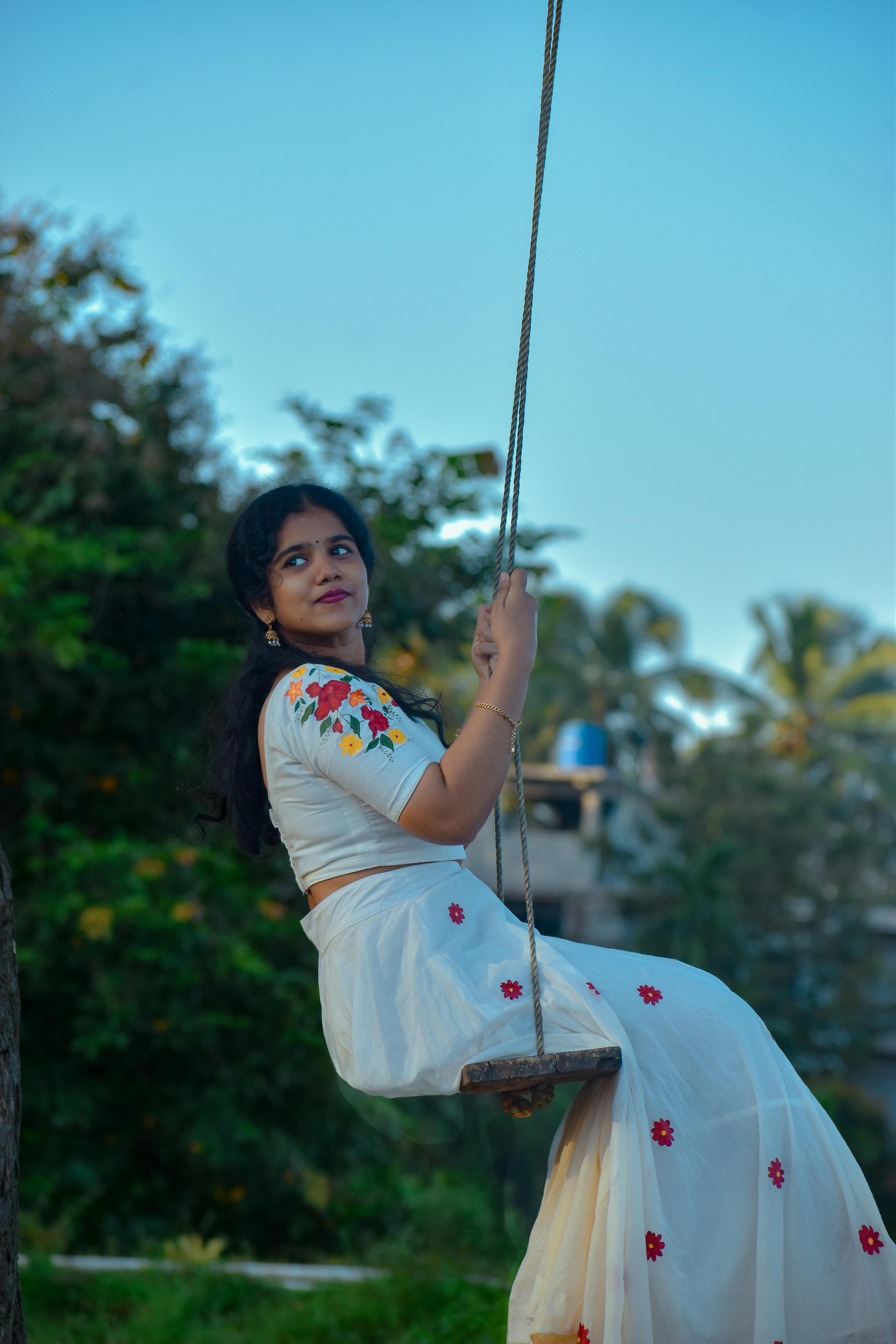 Young Woman Swinging in Traditional Kerala Attire · Free Stock Photo