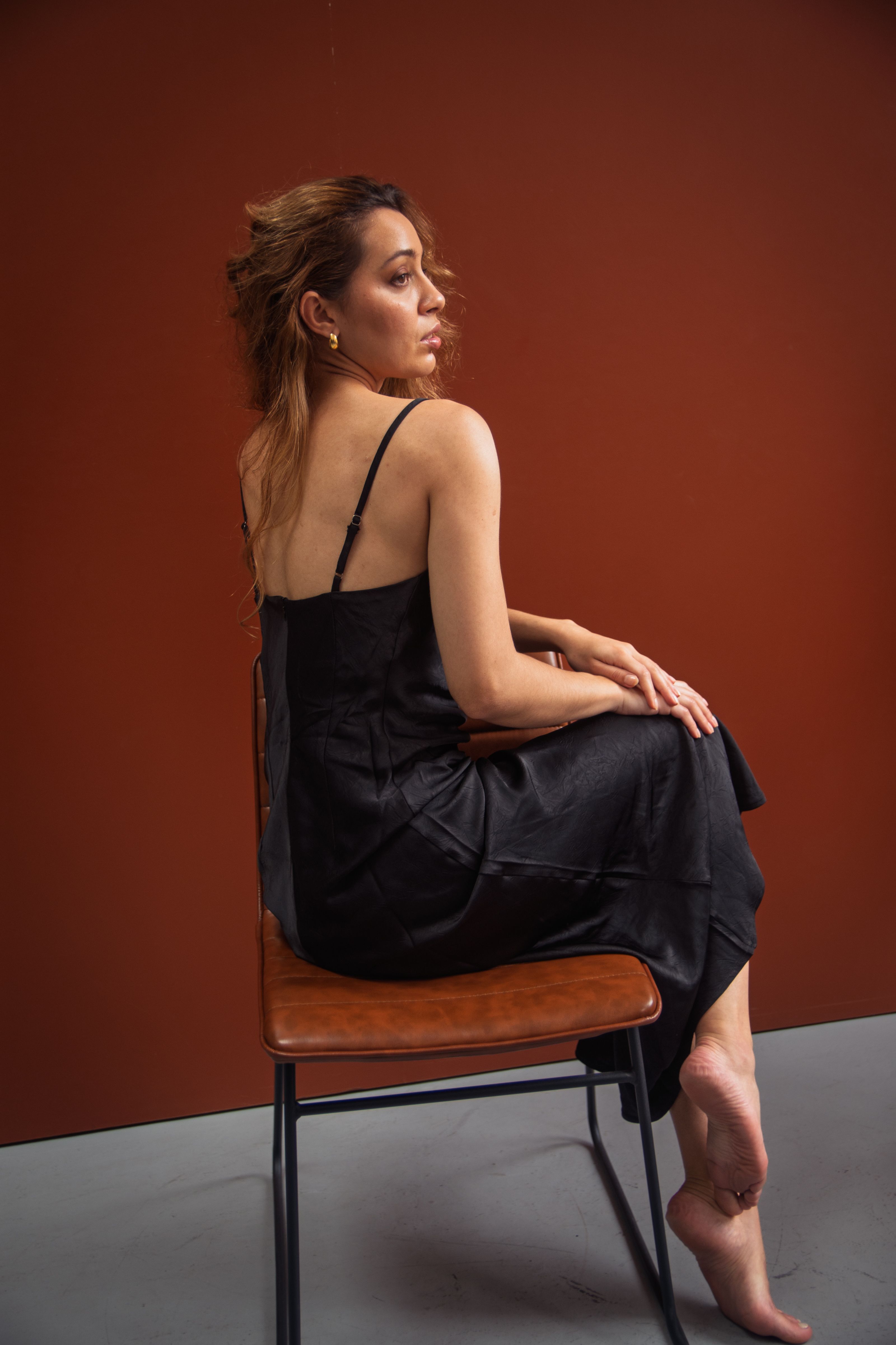 Young Woman Sitting and Posing · Free Stock Photo