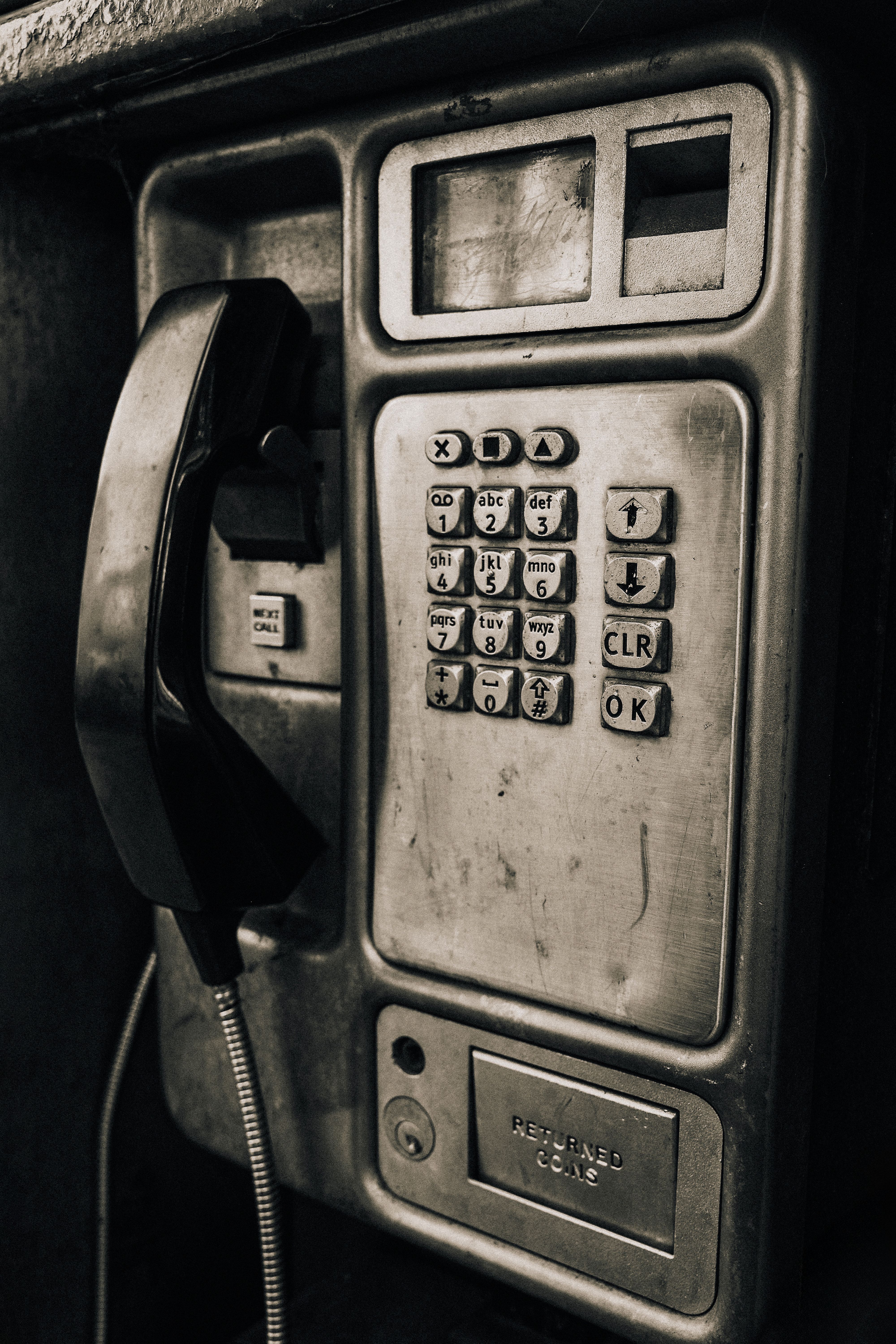 Vintage Payphone in Monochrome Setting · Free Stock Photo