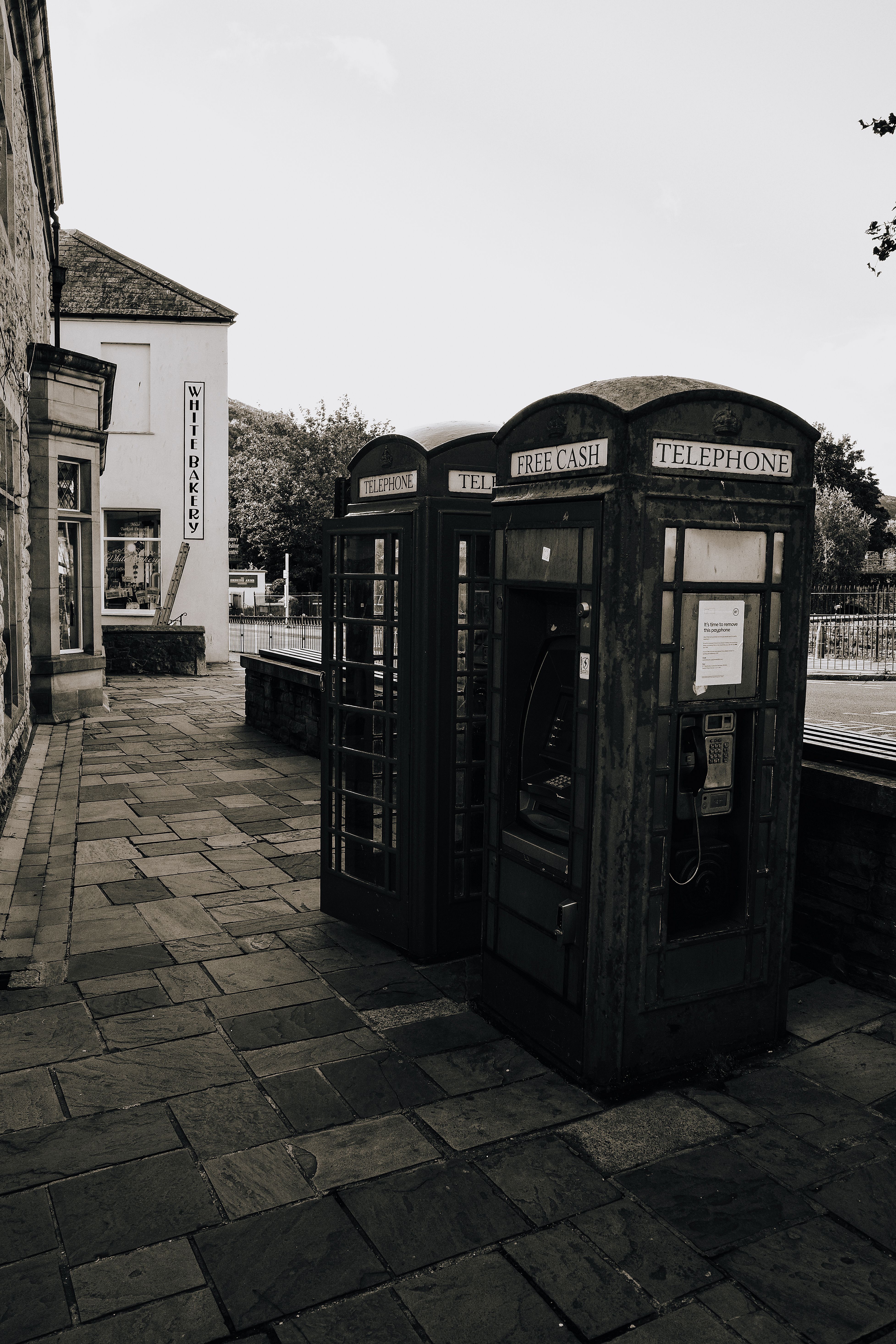 Vintage British Telephone Booths in Urban Setting · Free Stock Photo