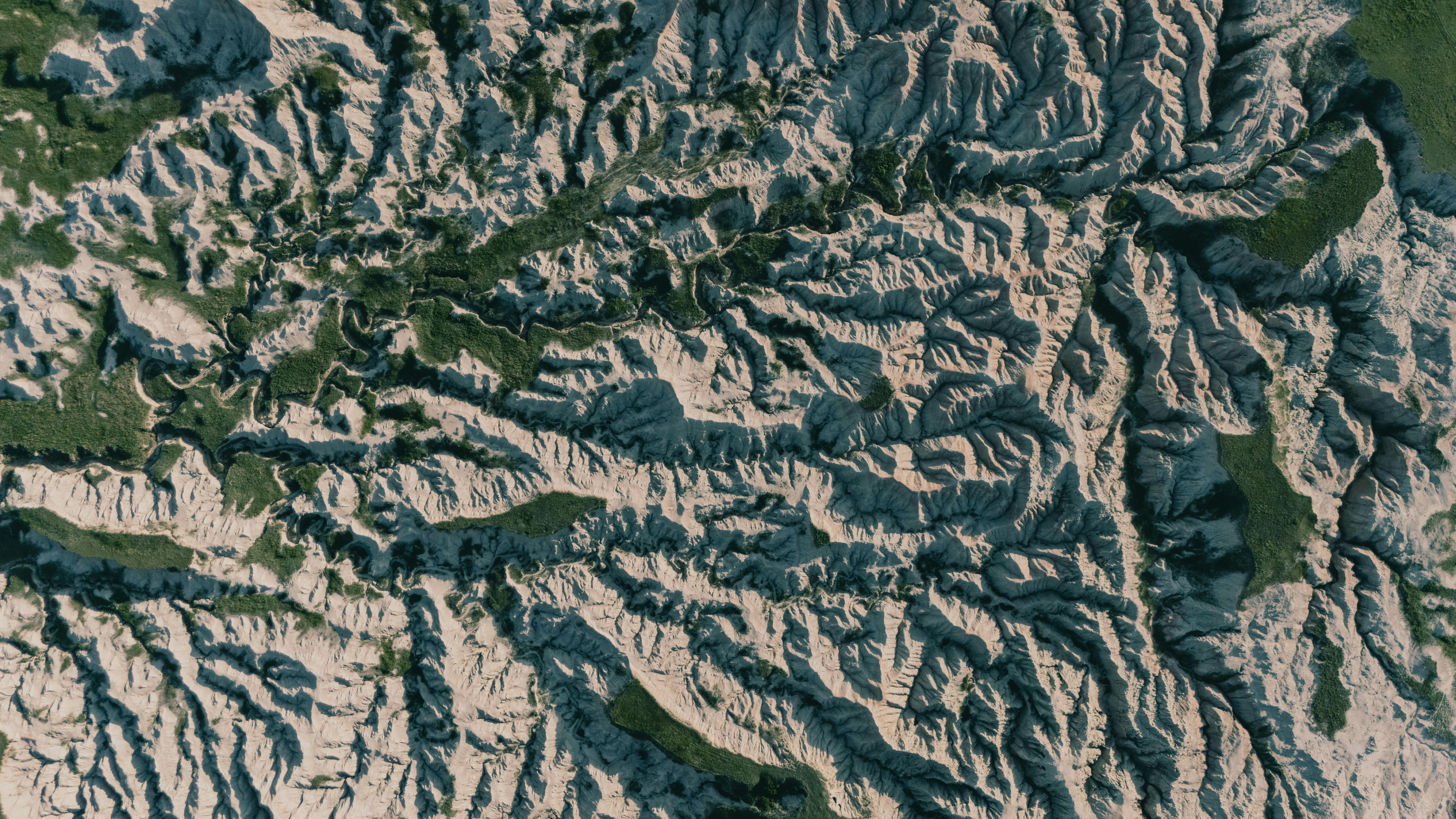 Aerial View of Rugged Badlands Landscape · Free Stock Photo