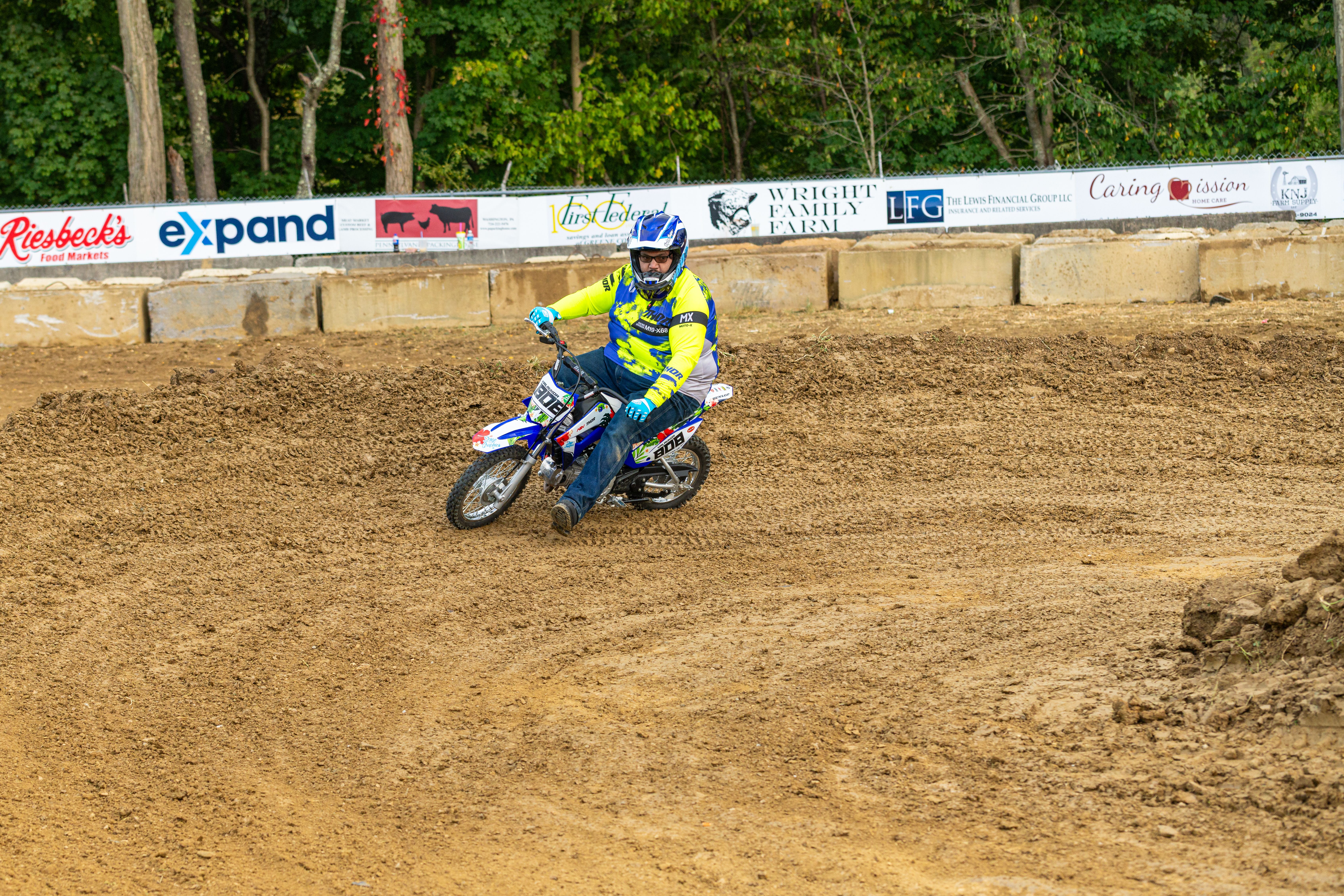 Exciting Dirtbike Race on Dirt Track in Fall · Free Stock Photo