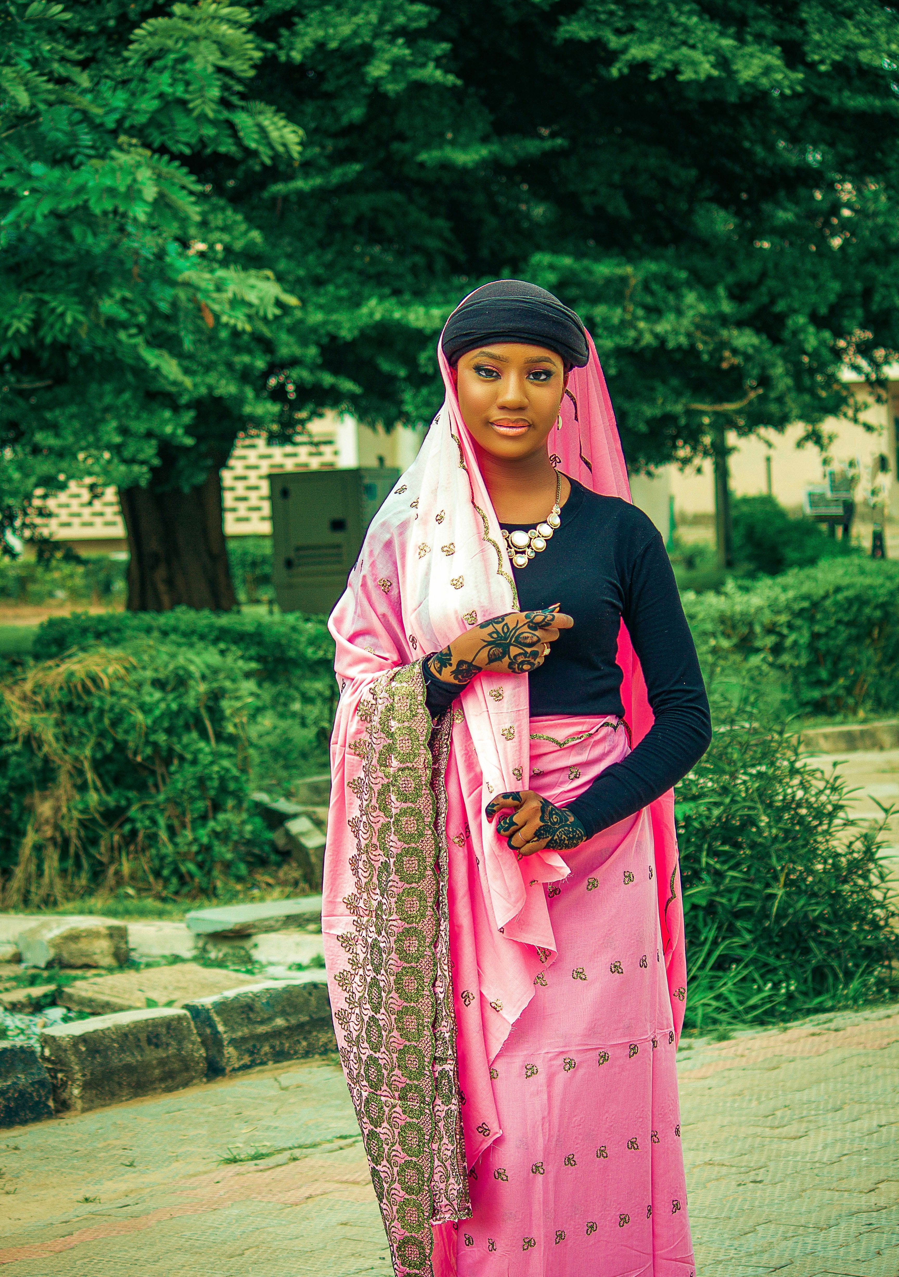 Elegant Woman in Traditional Pink Cultural Dress · Free Stock Photo