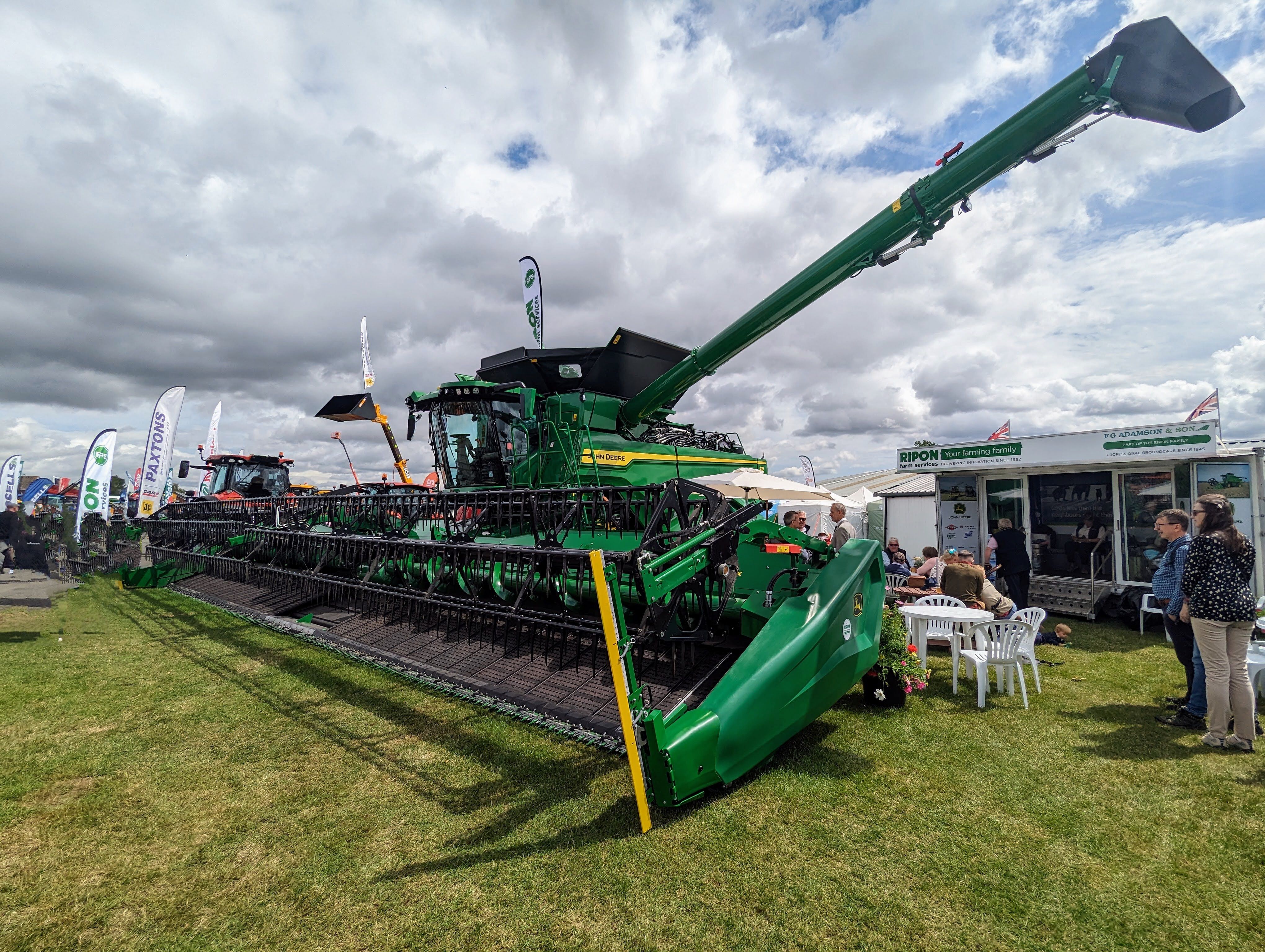 Large Green Combine Harvester at Outdoor Agricultural Show · Free Stock ...