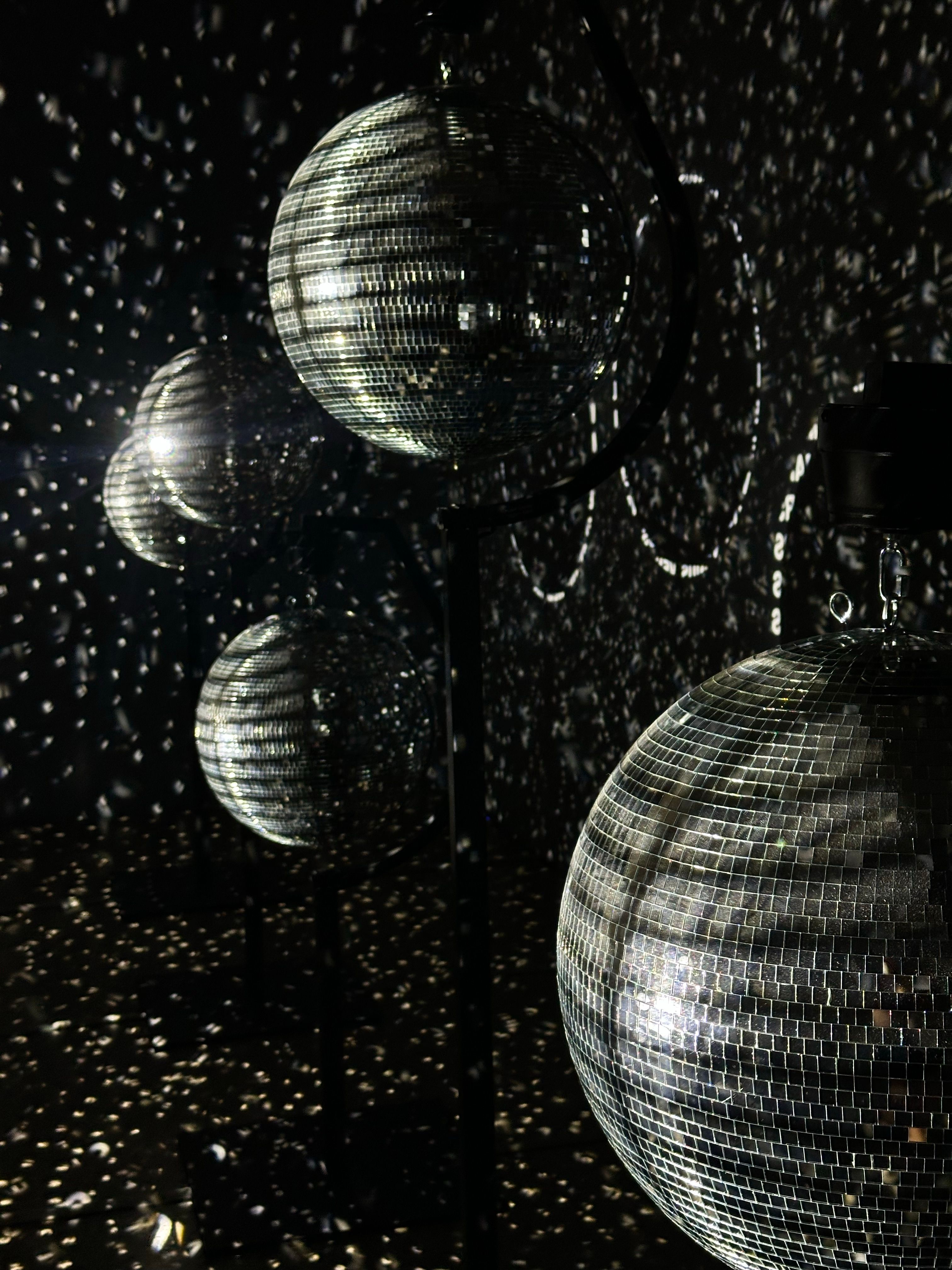Glittering Disco Balls Casting Reflective Light · Free Stock Photo