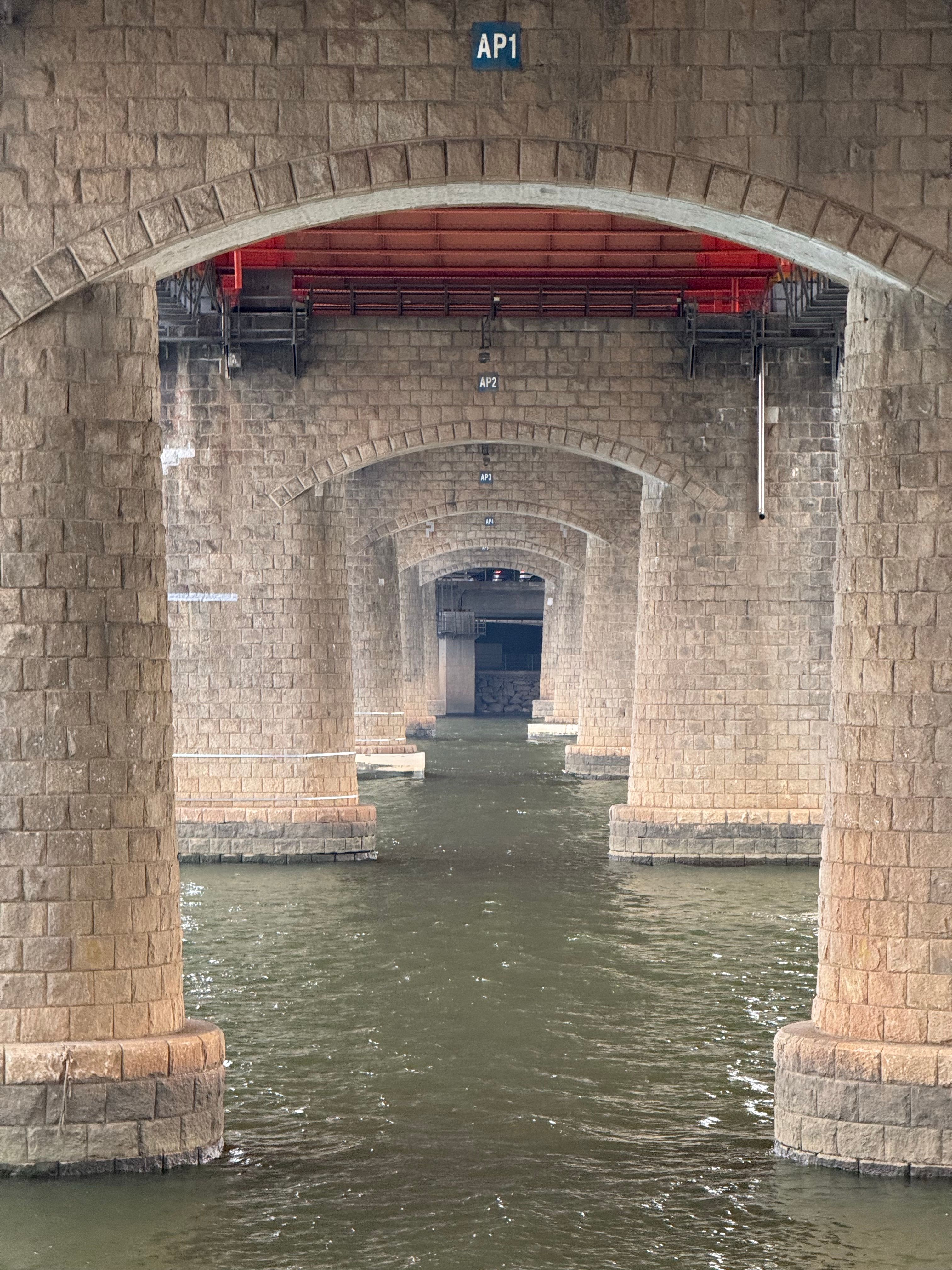 Architectural Columns under Urban Bridge · Free Stock Photo